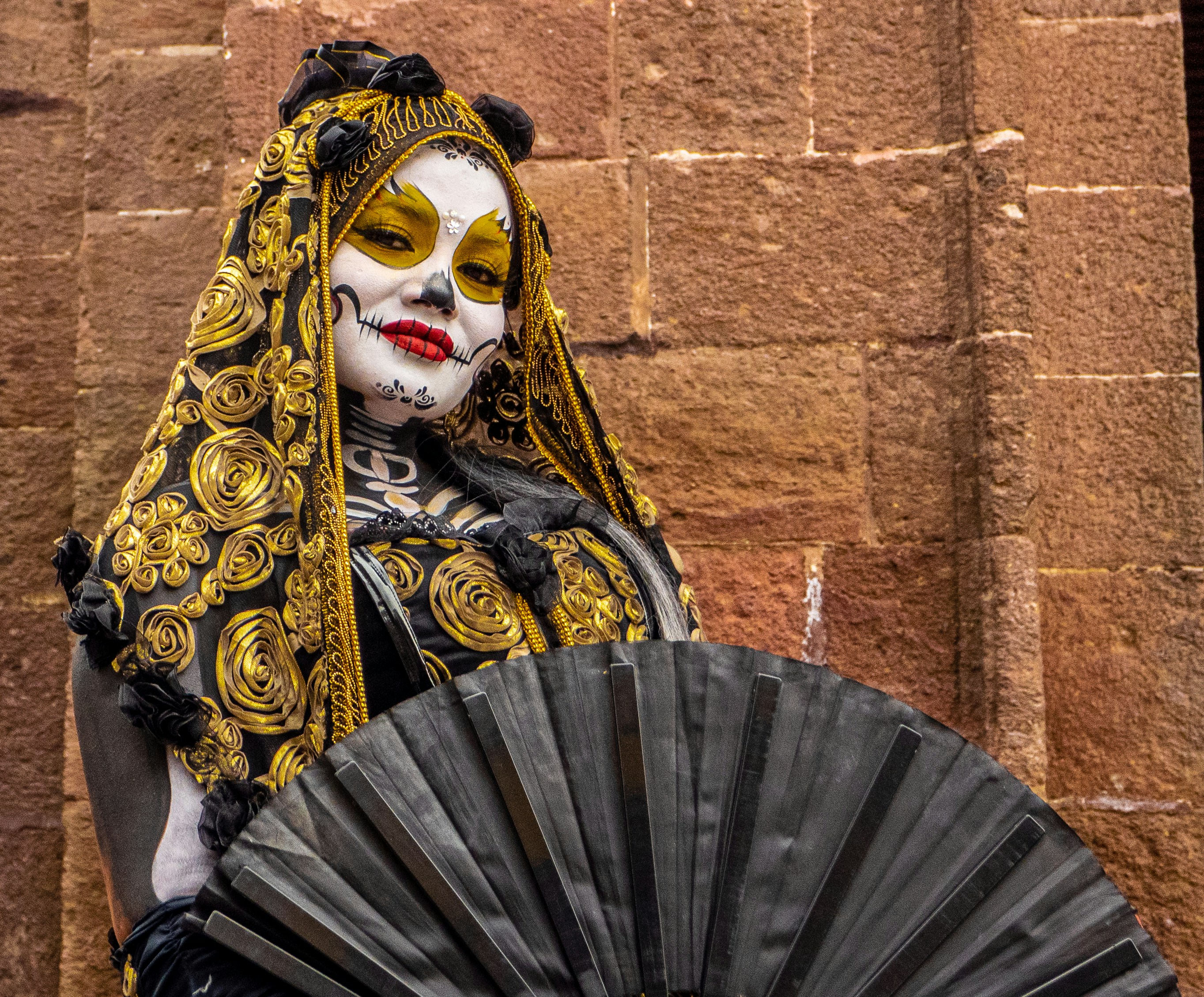 A woman with a skeleton make up holding a fan photo – Free Human Image ...