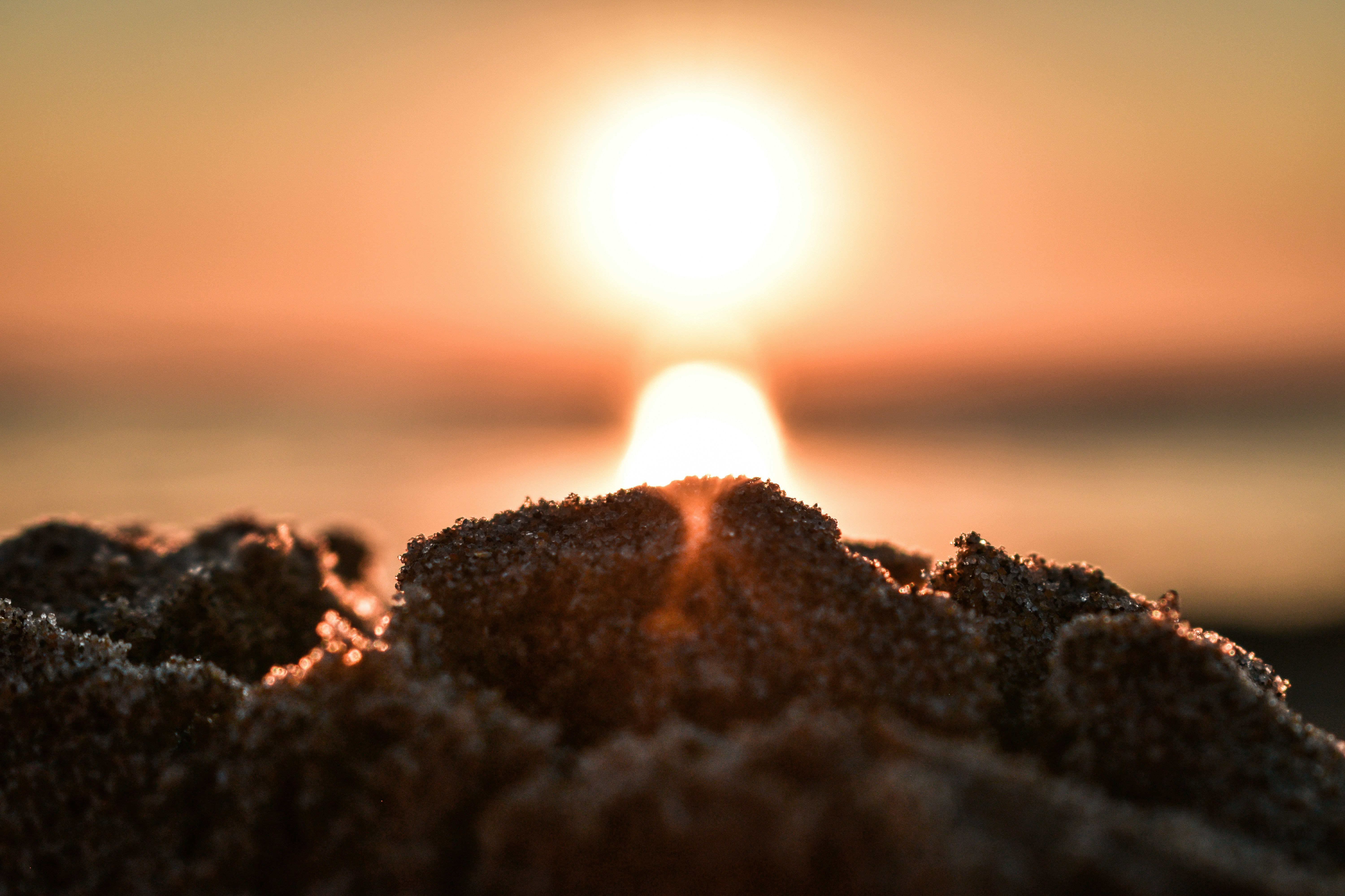 The sun is setting over a beach with sand photo – Free Langevelderslag ...