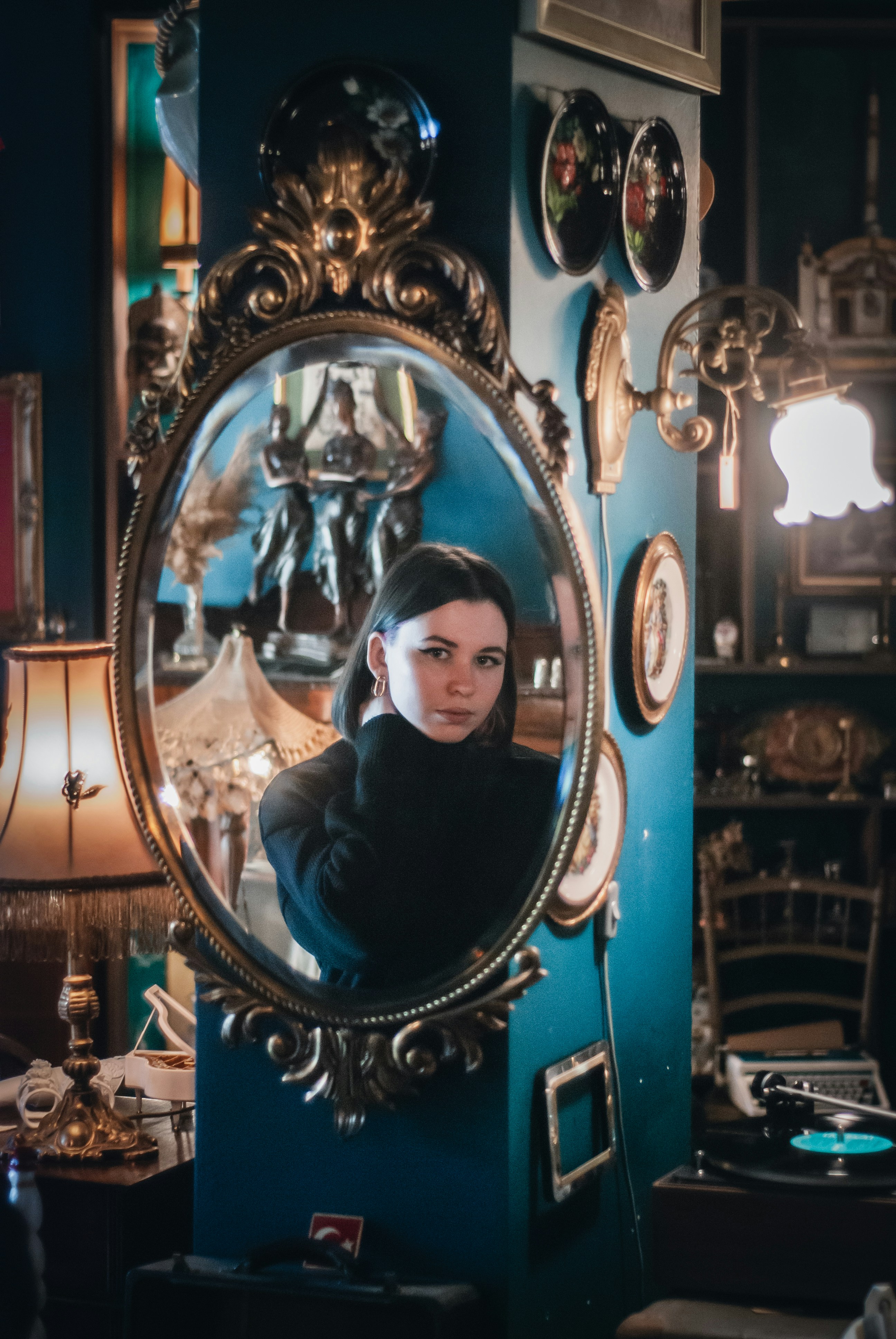 A woman's reflection in a mirror in a room photo – Free Person Image on ...