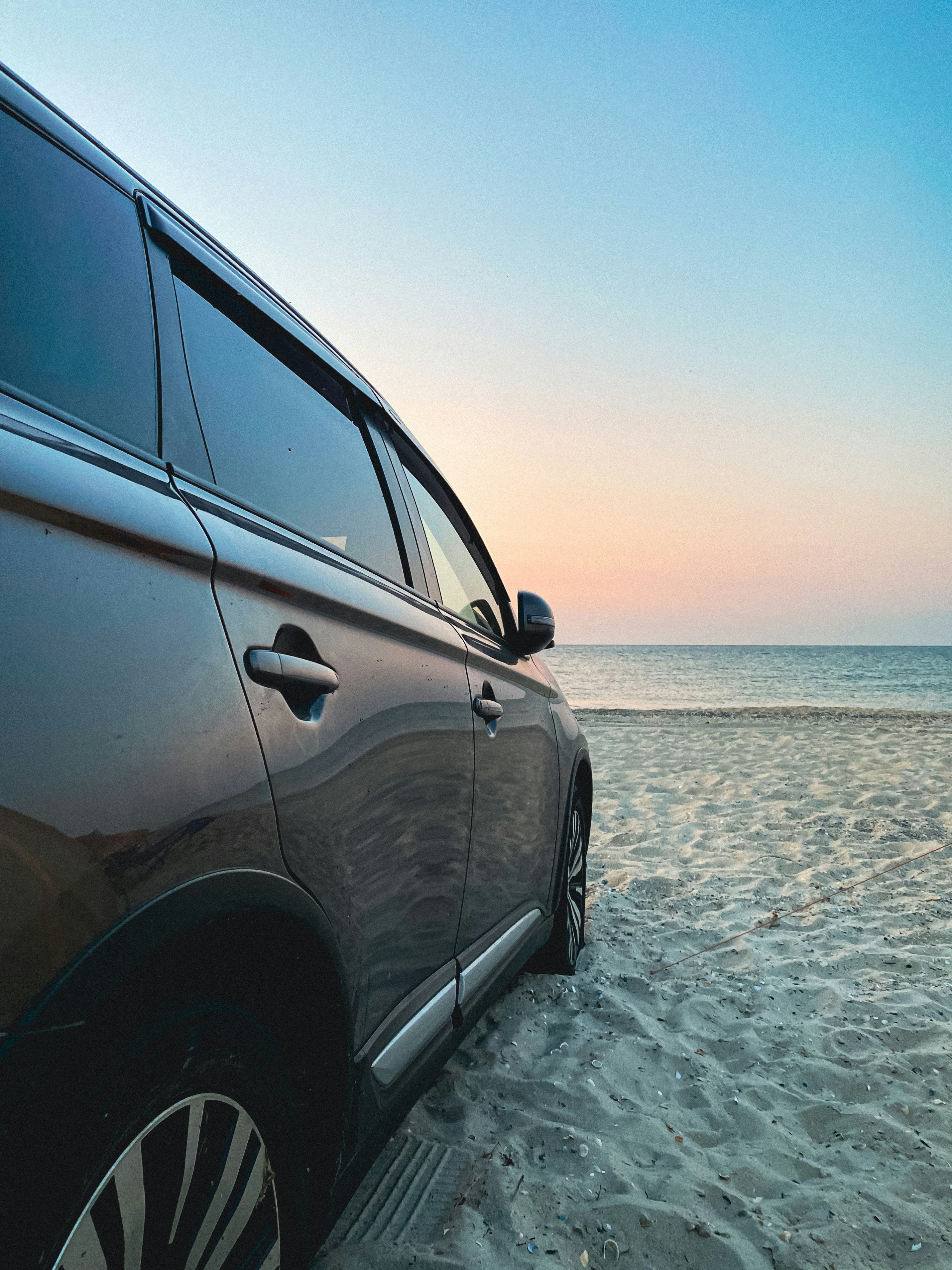 A car parked on a beach near the ocean photo – Free Bilhorod-dnistrovs ...