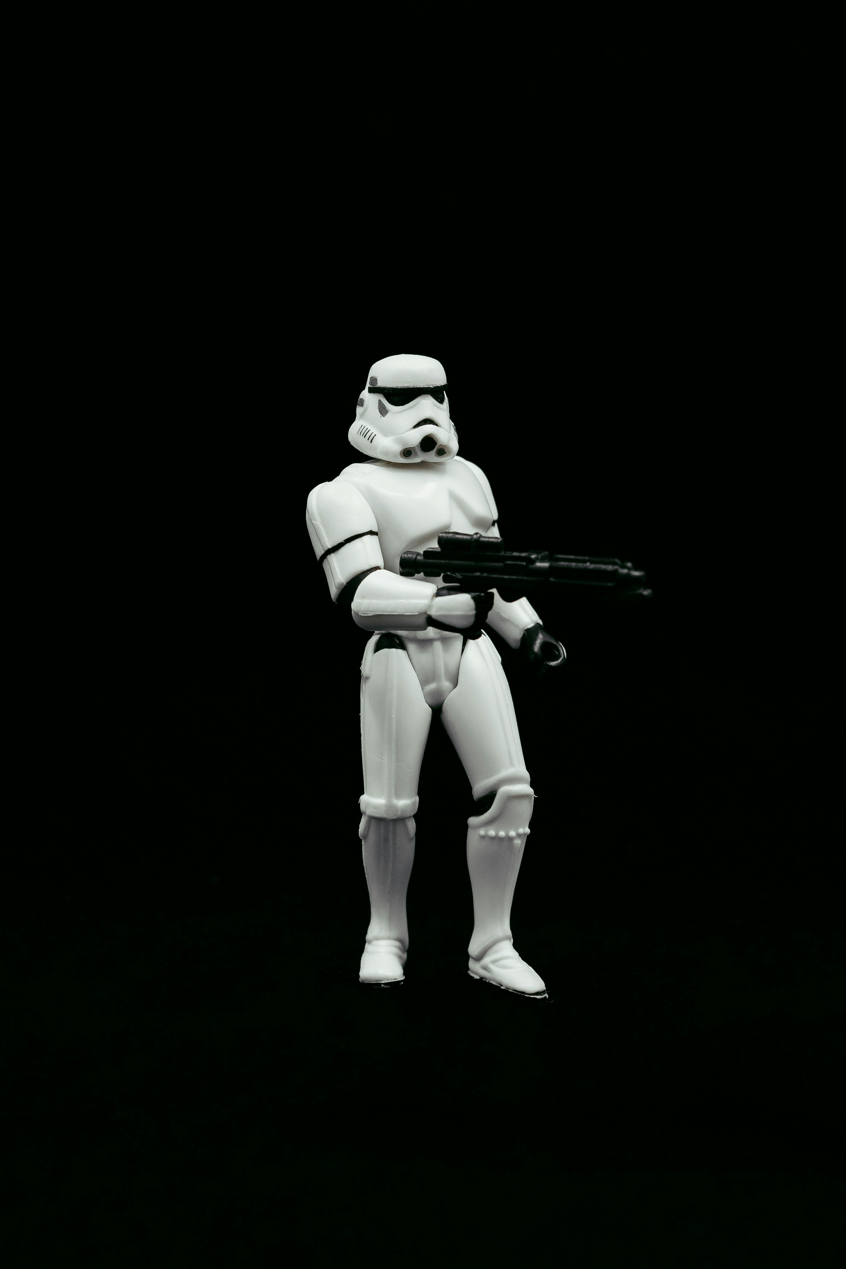 A star wars action figure holding a gun photo – Free Grey Image on Unsplash