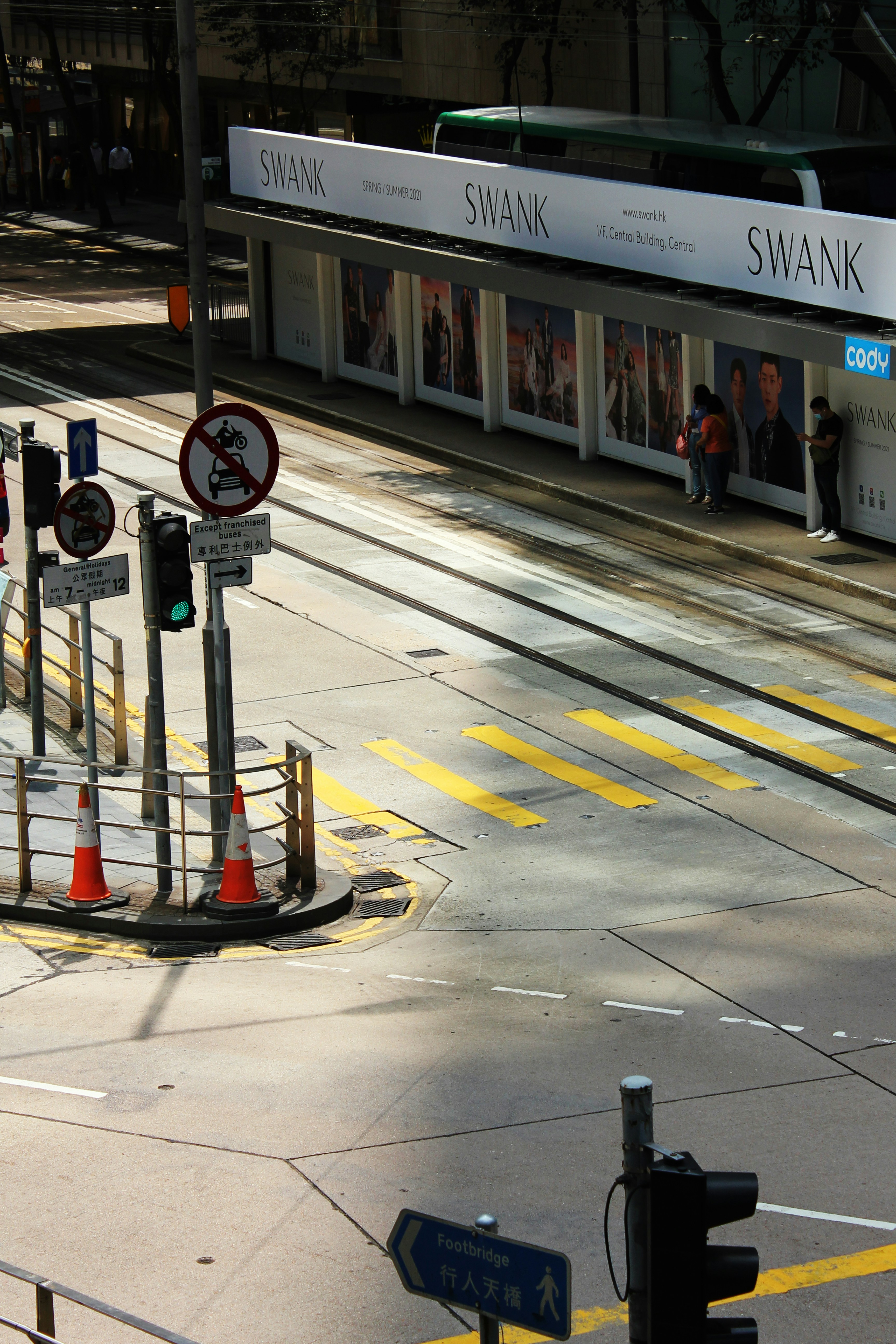 A street corner with traffic lights and street signs photo – Free Hong ...