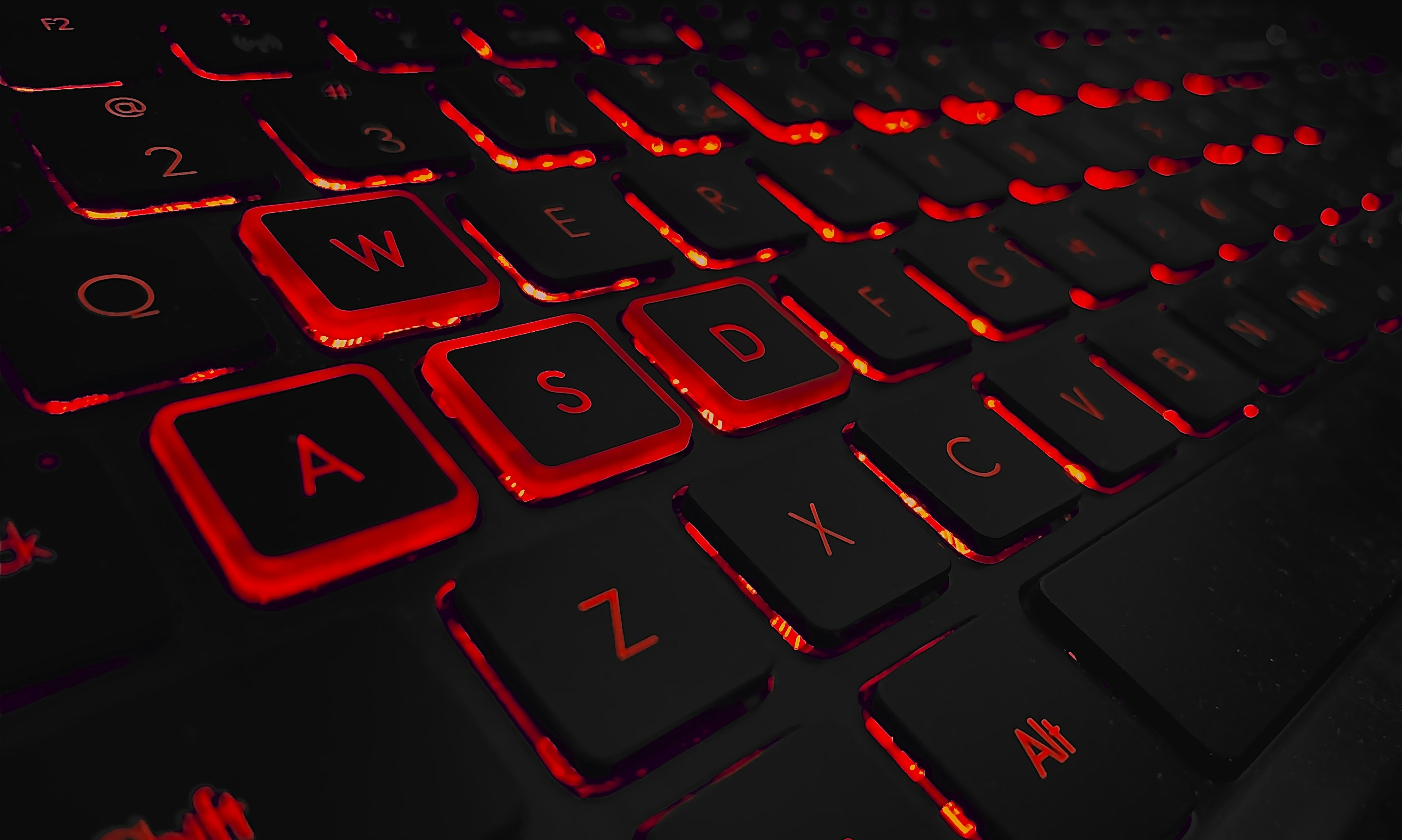 A close up of a keyboard with red keys photo – Free Red Image on Unsplash