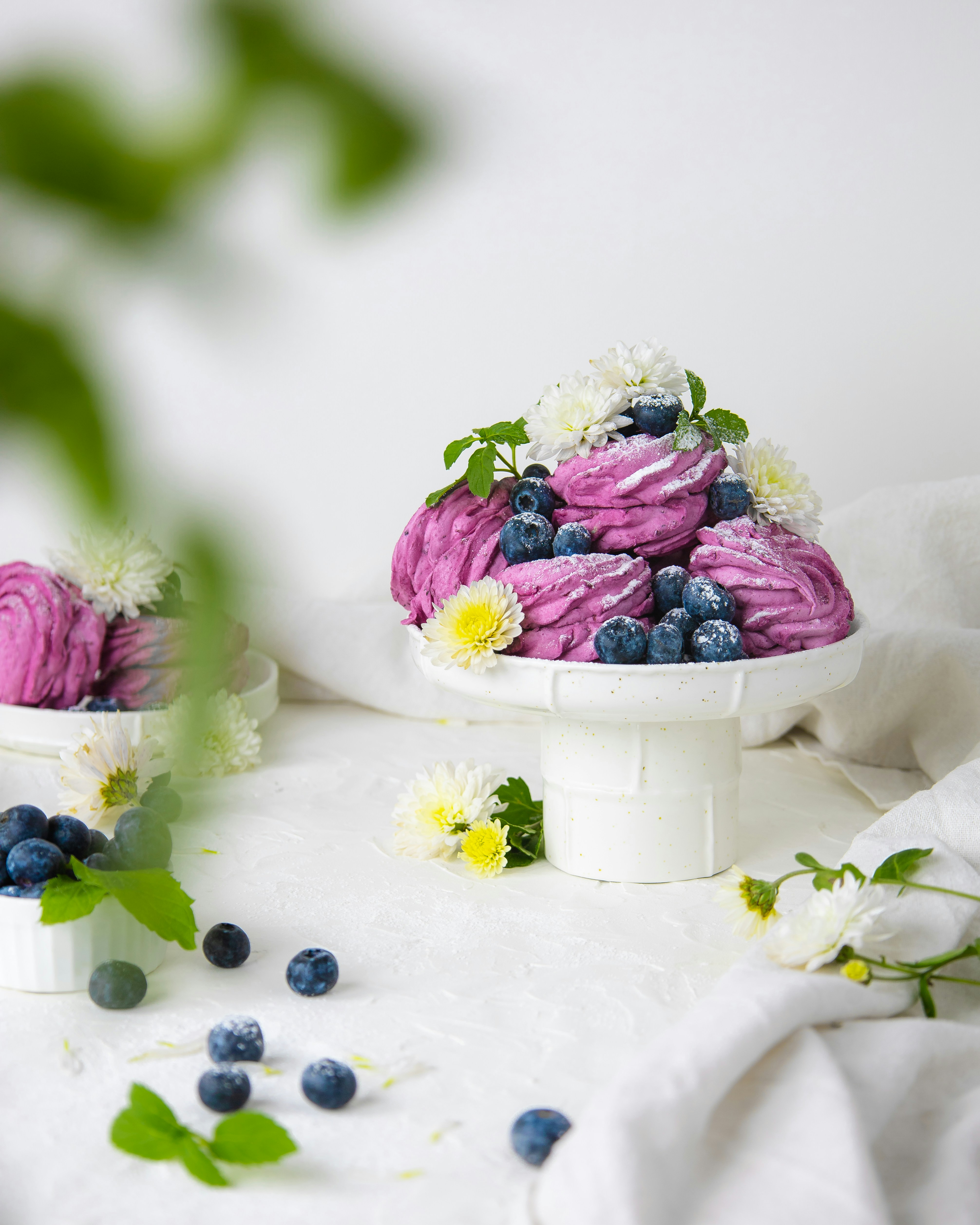 Pink Swirl Cake Arrangement with Blueberries on a White Pedestal