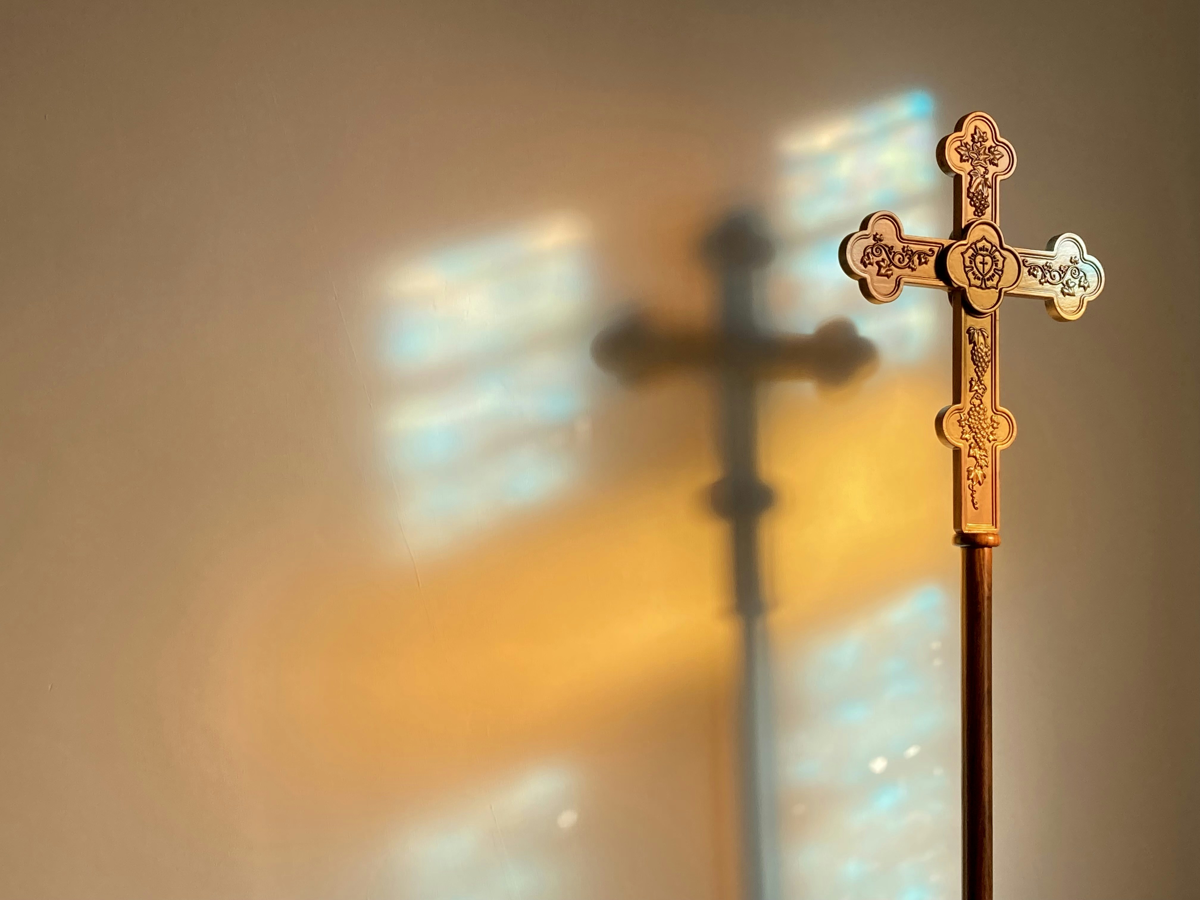Shadows of a Sacred Cross: A Quiet Moment in Warm Light