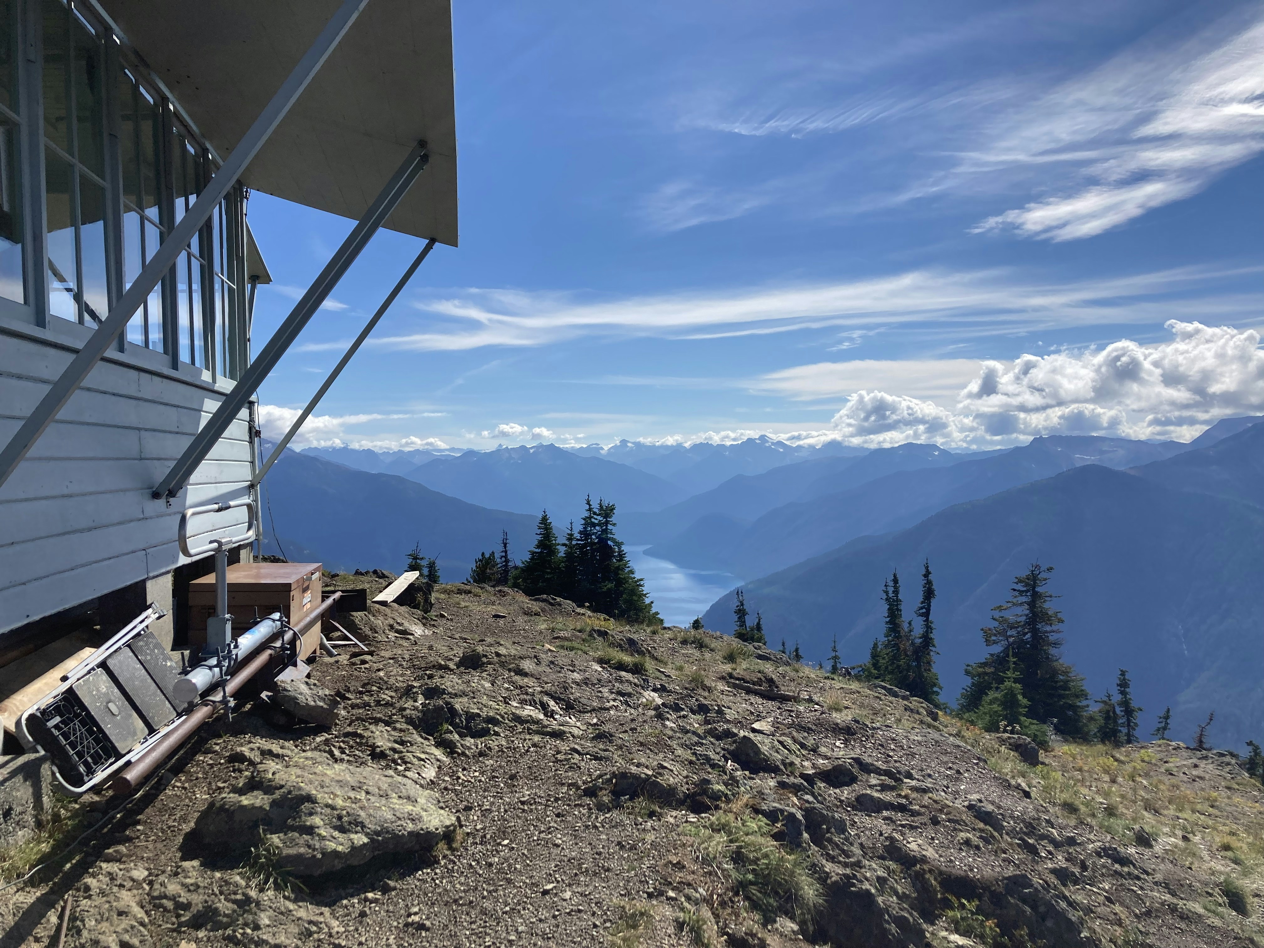 Alpine Outpost: Ridge Shelter Framed by Sky and Stones