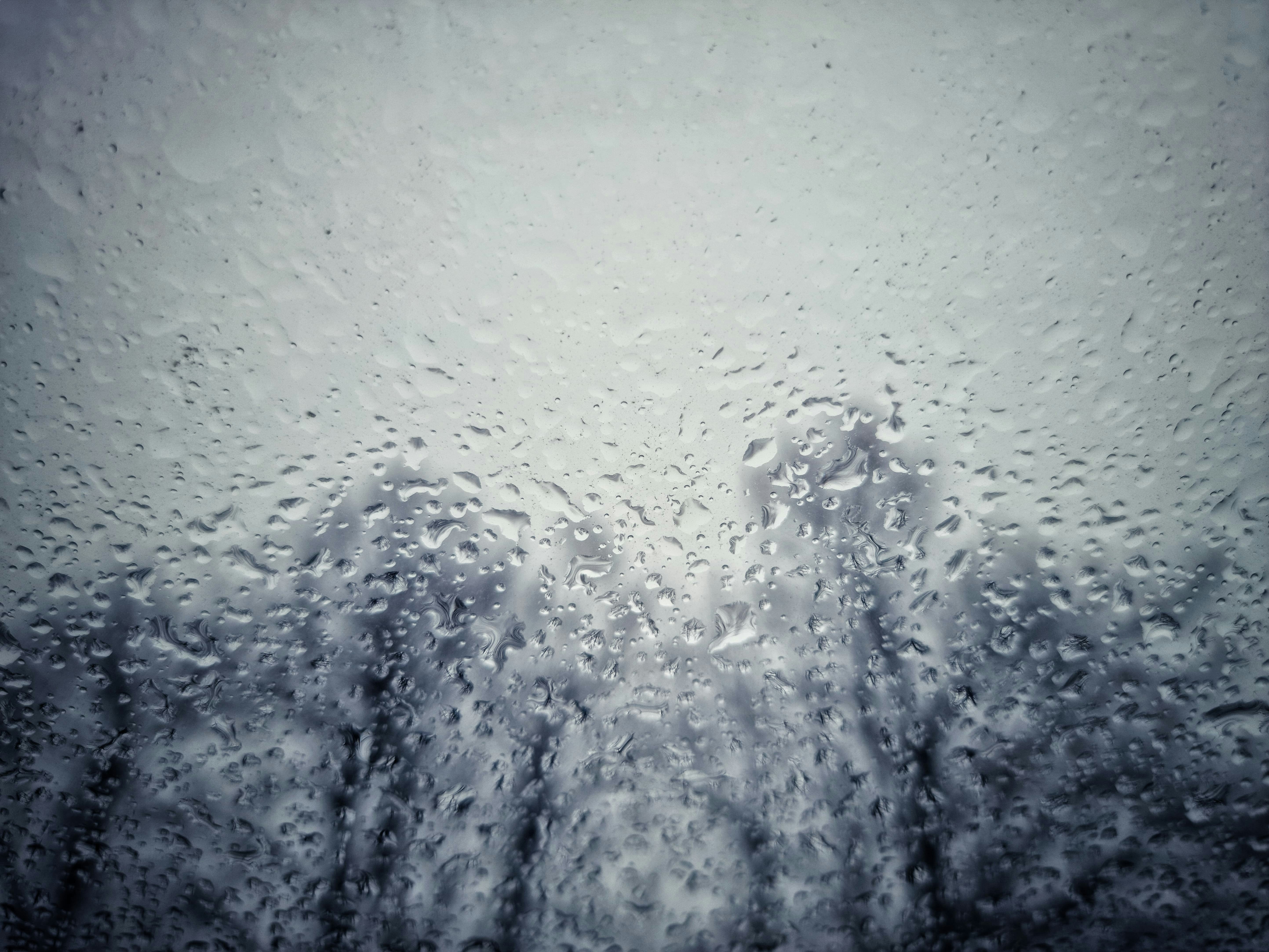 A rain covered window with lots of drops of water photo – Free Grey ...