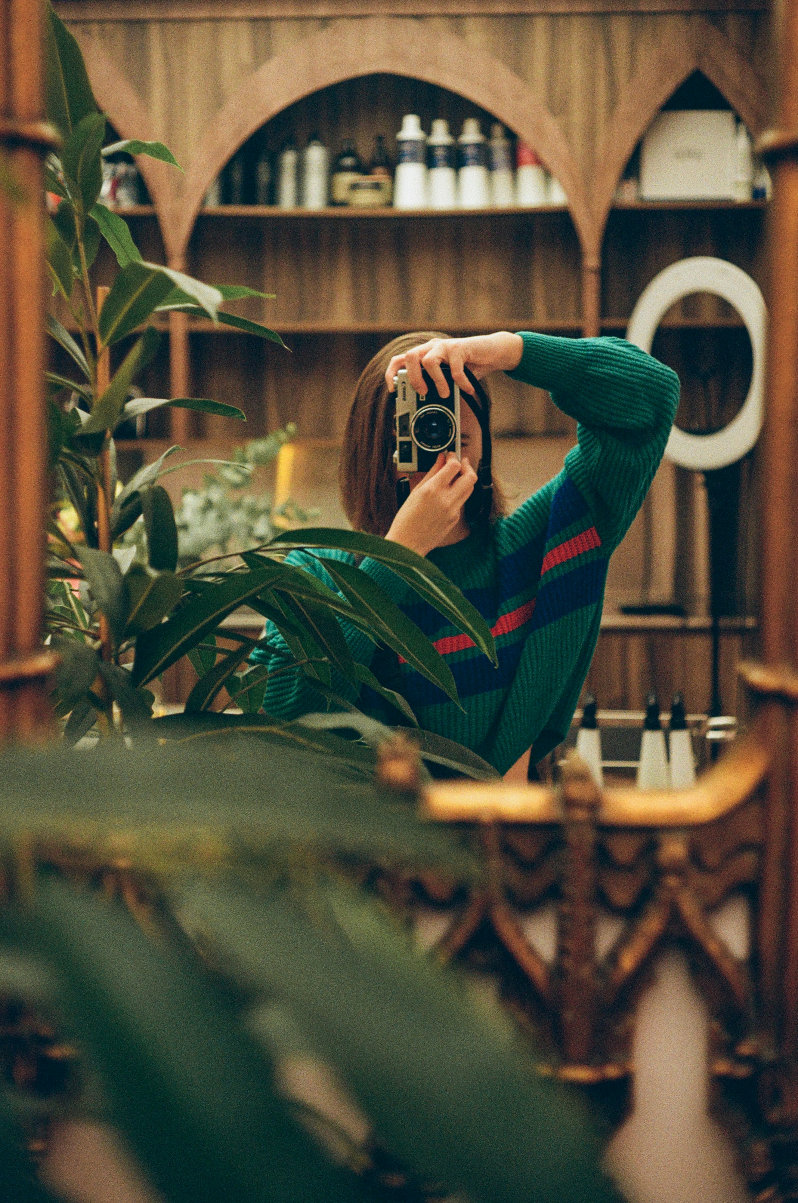 Self-Portrait Through Glass and Leaves: A Vintage Canonet Moment