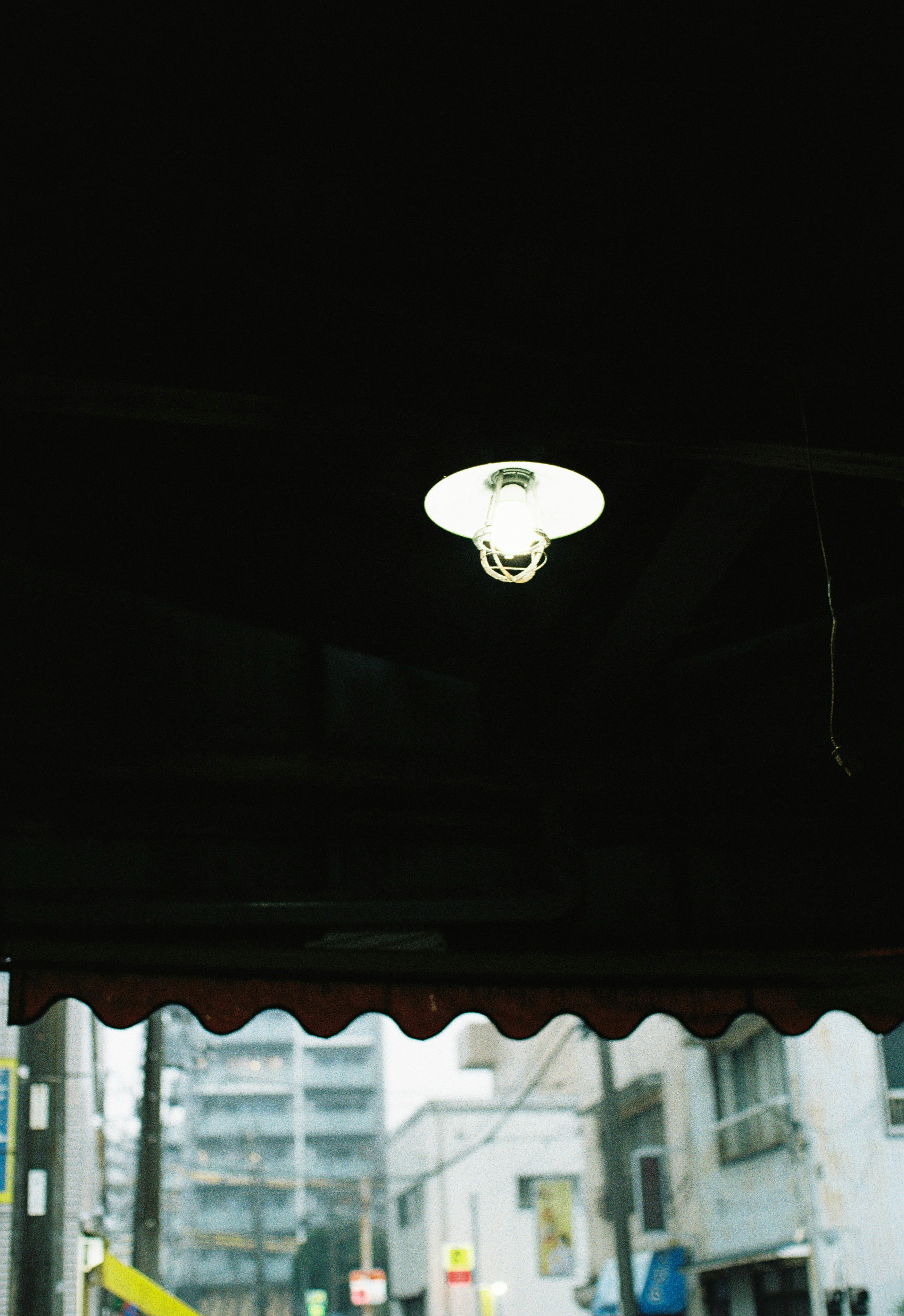 a street scene with focus on a street light