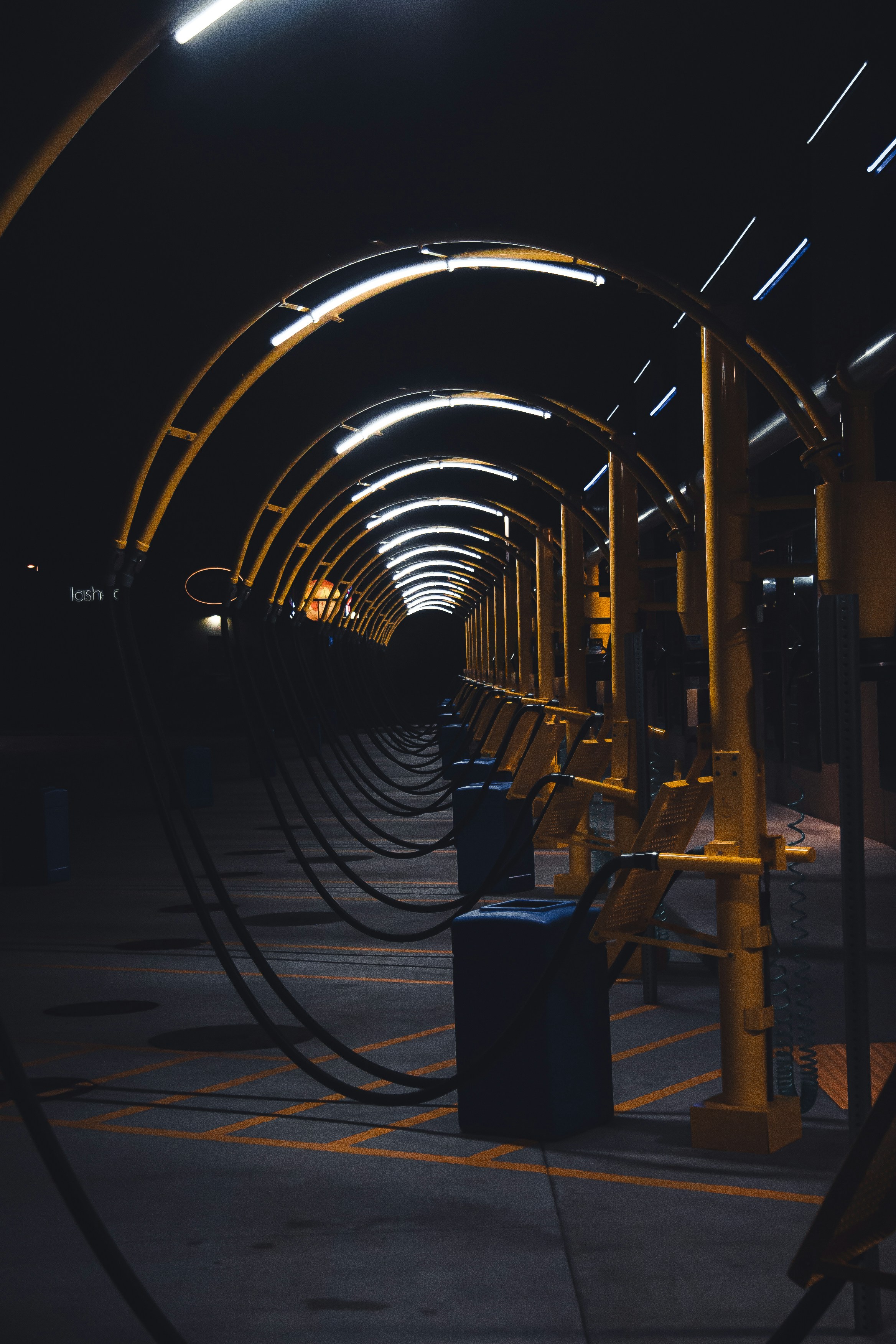 Vanishing Rings: Night Walk Through a Tunnel of Yellow Arches