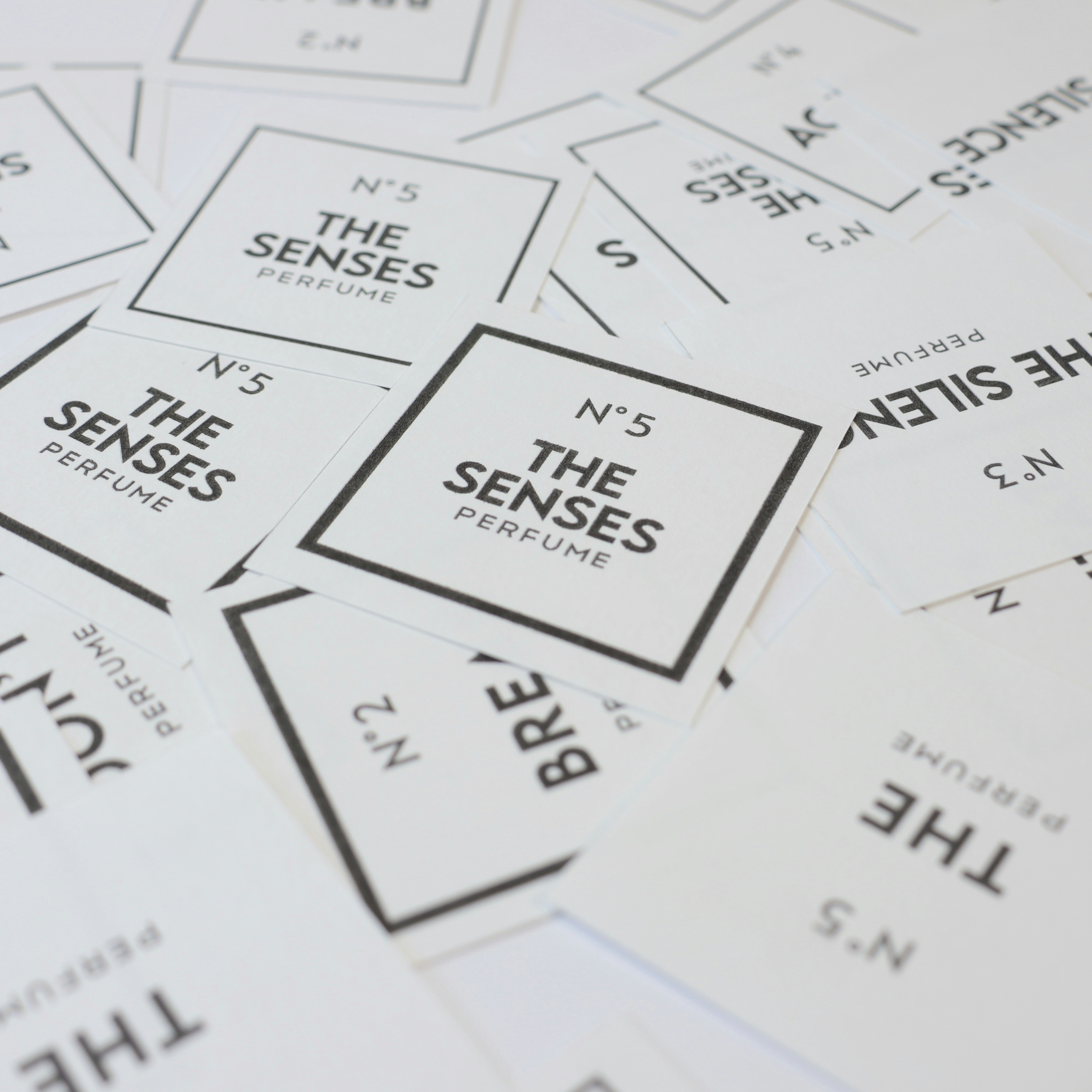 A close up of a bunch of labels on a table photo – Free Paper Image on ...