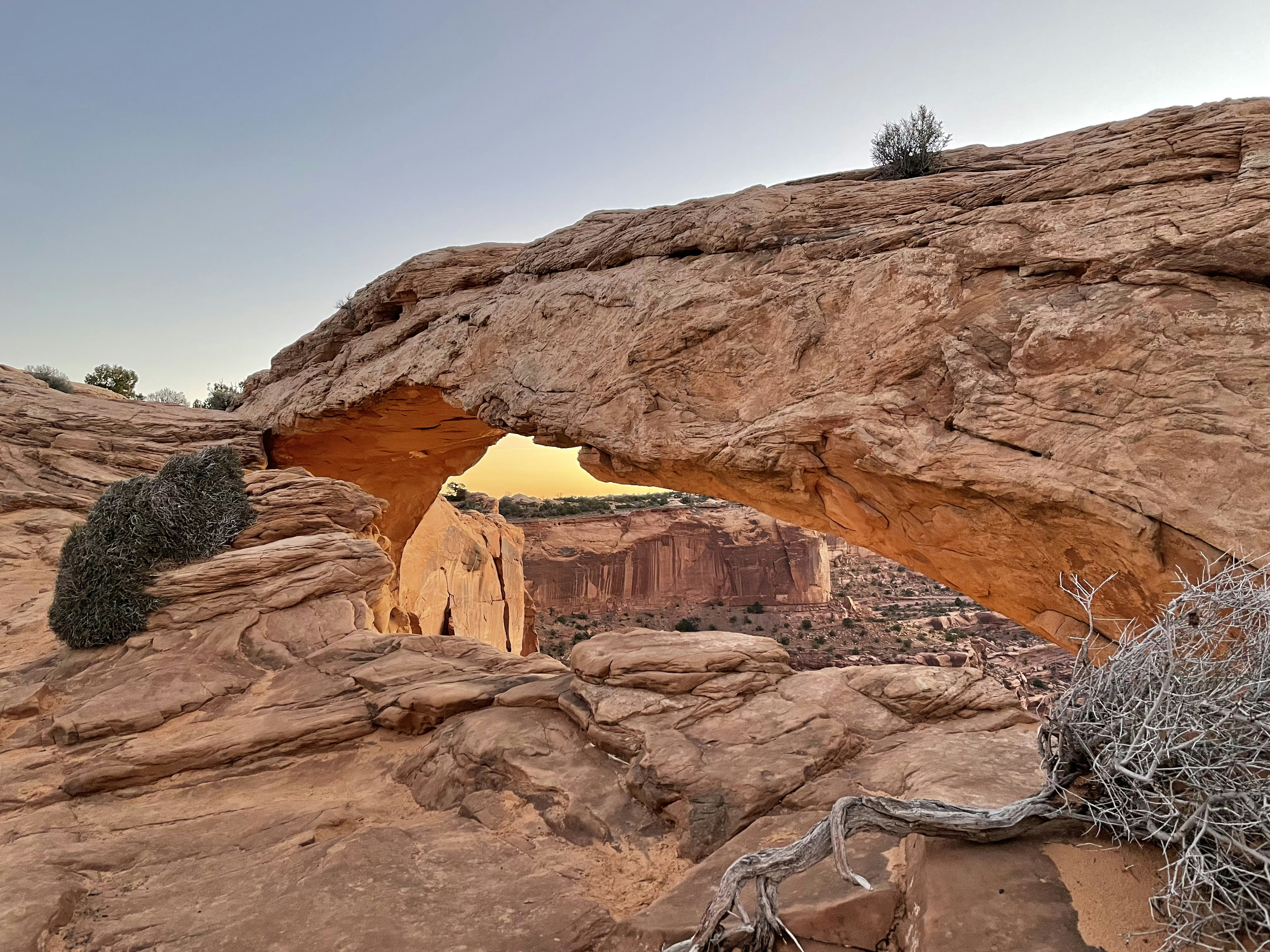Desert Stone Arch: A Natural Window Framing a Distant Canyon