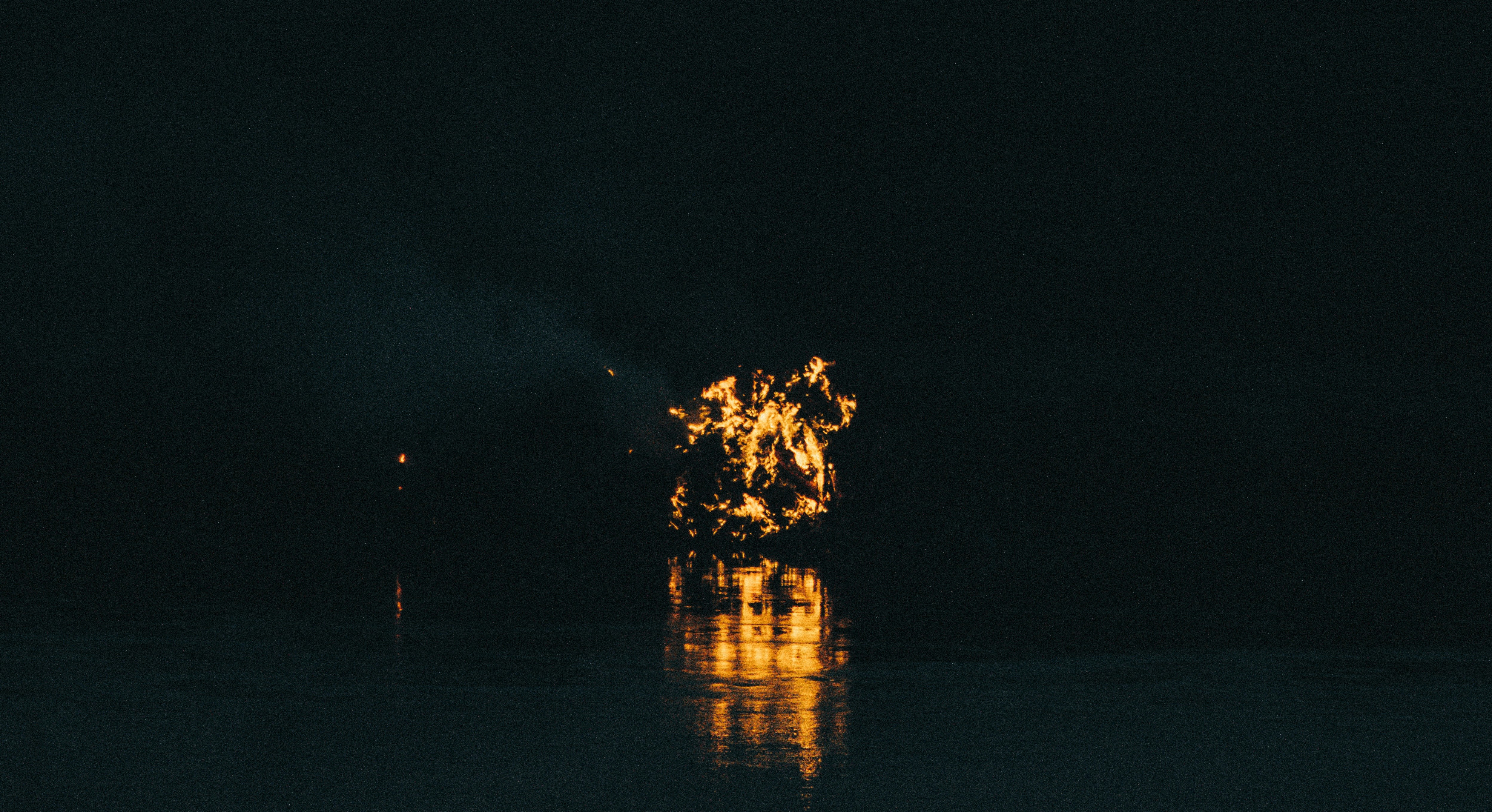 A fire is lit up in the dark photo – Free Nature Image on Unsplash