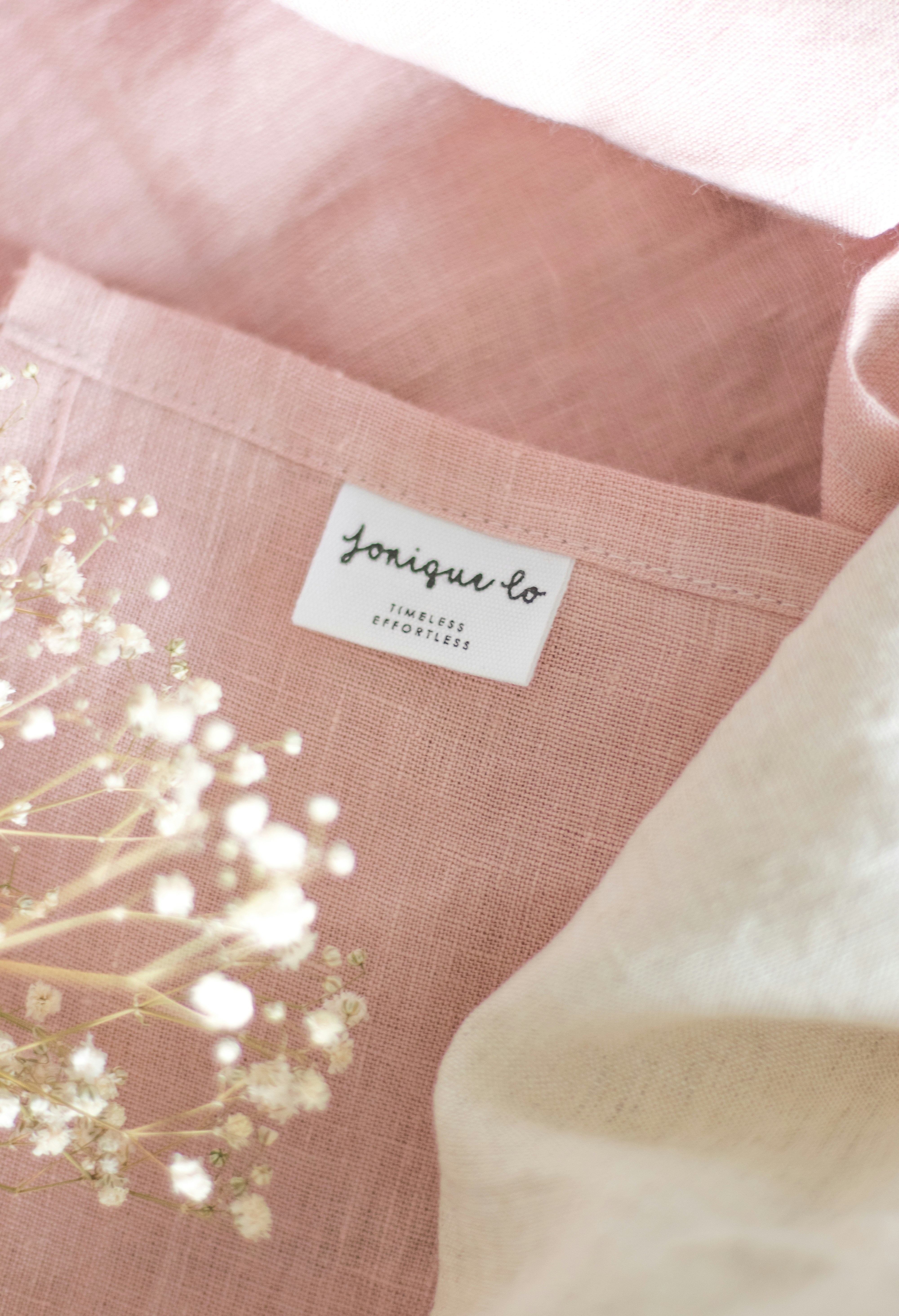 Soft Pink Linen with a Quiet Brand Tag and Delicate Florals