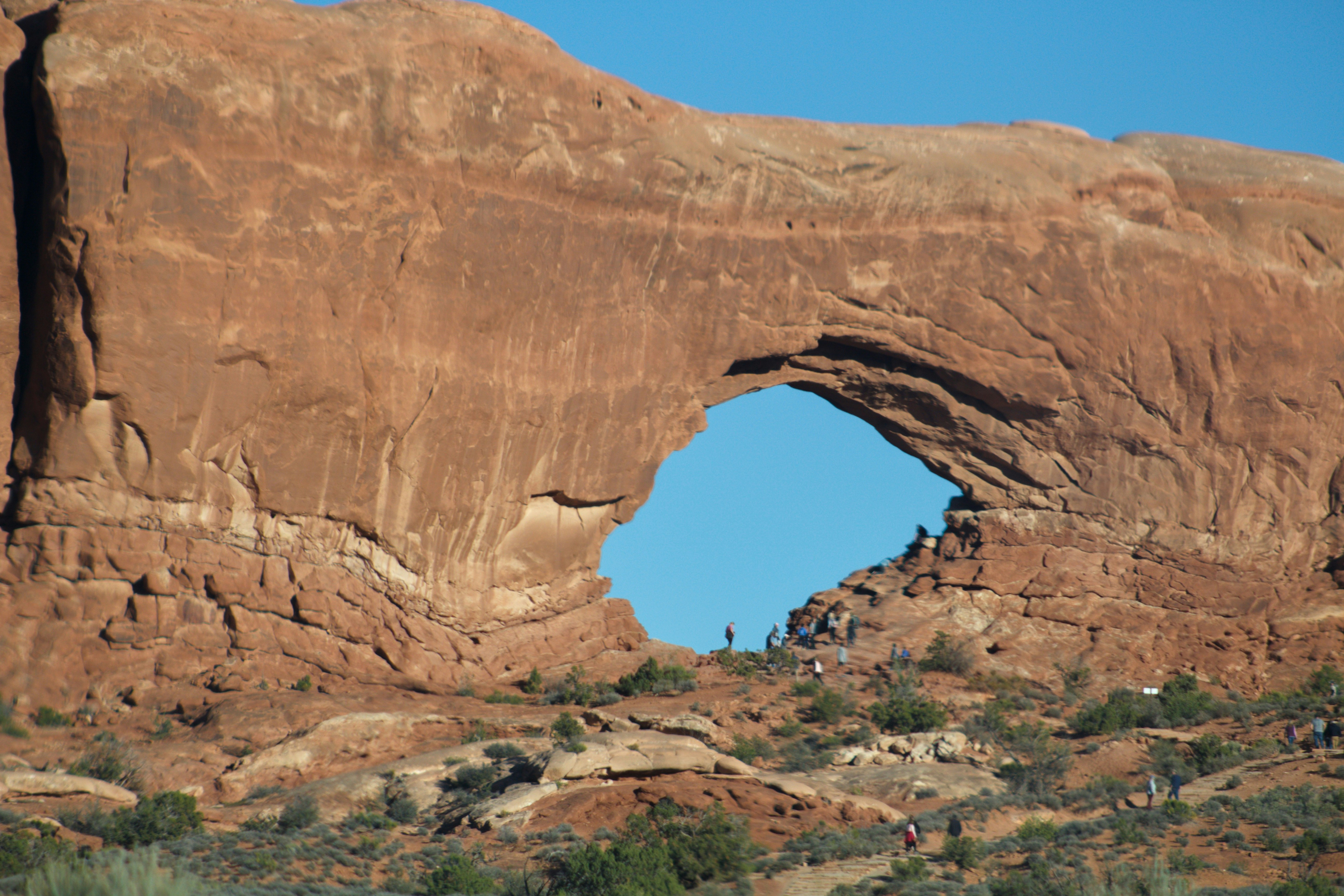 A large rock formation with a hole in the middle photo – Free Building ...