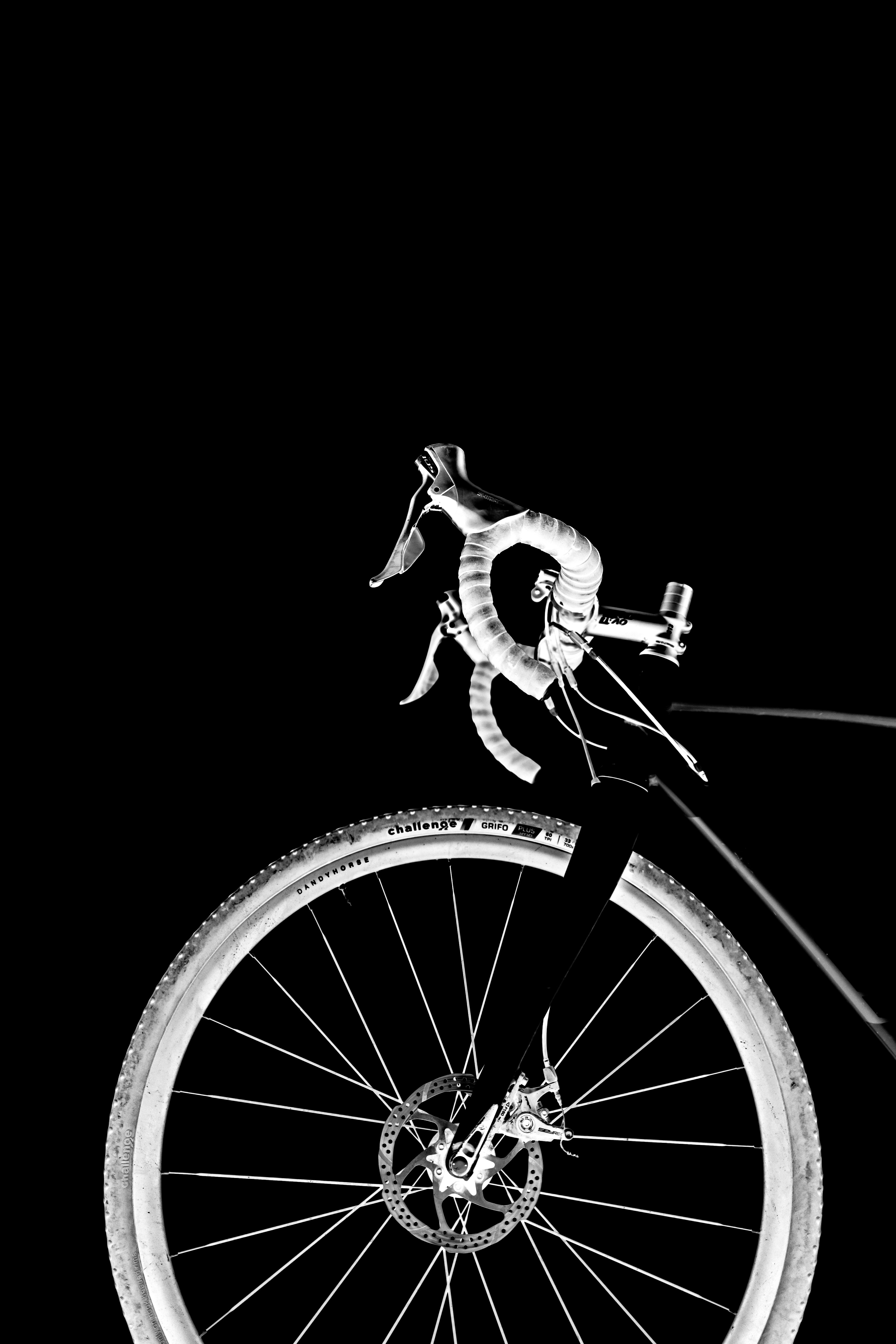 Wrapped Arc in Midnight Light: The Front End of a Road Bike