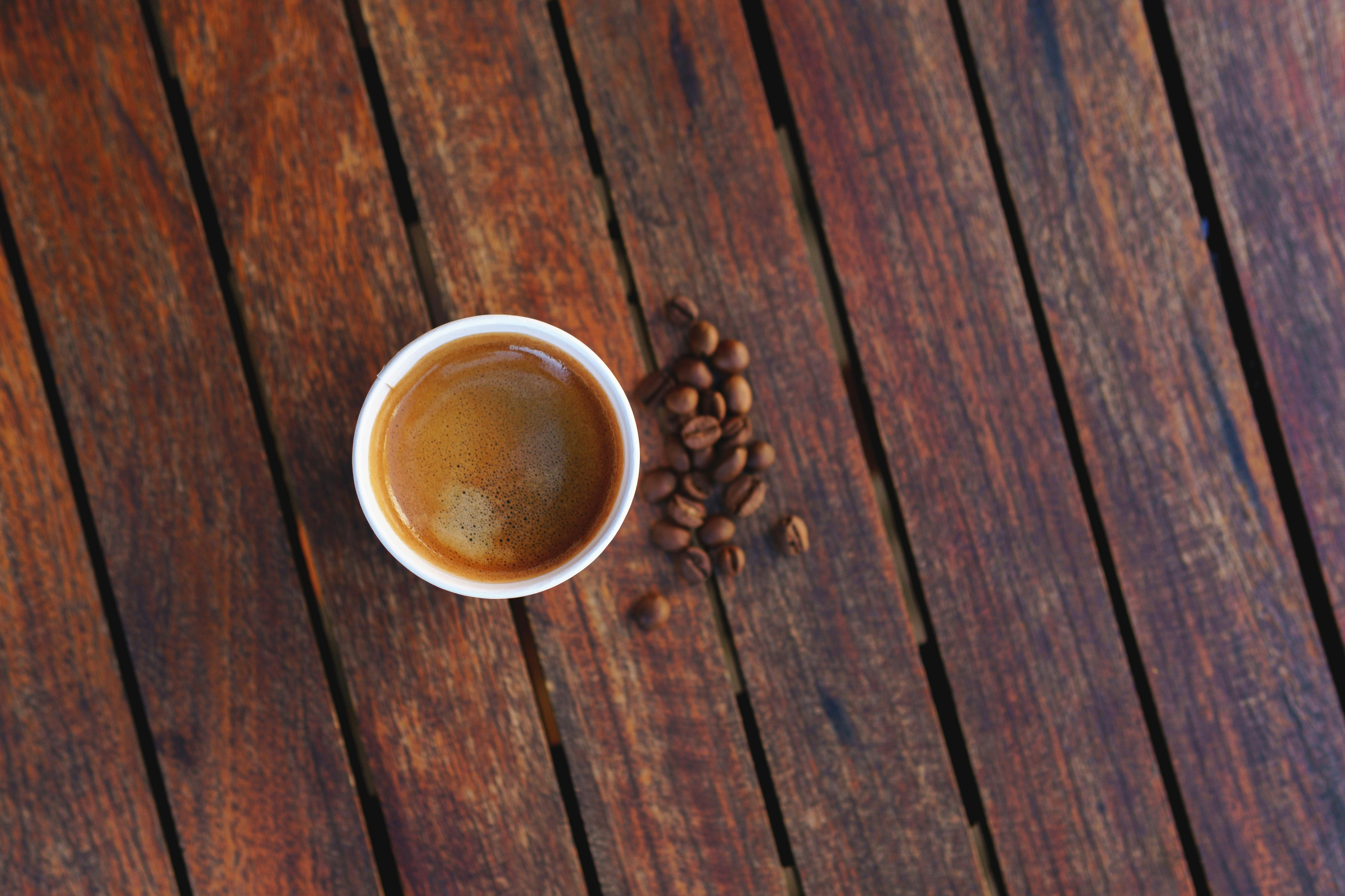 Espresso Orbit on Weathered Planks: A Quiet Overhead Moment