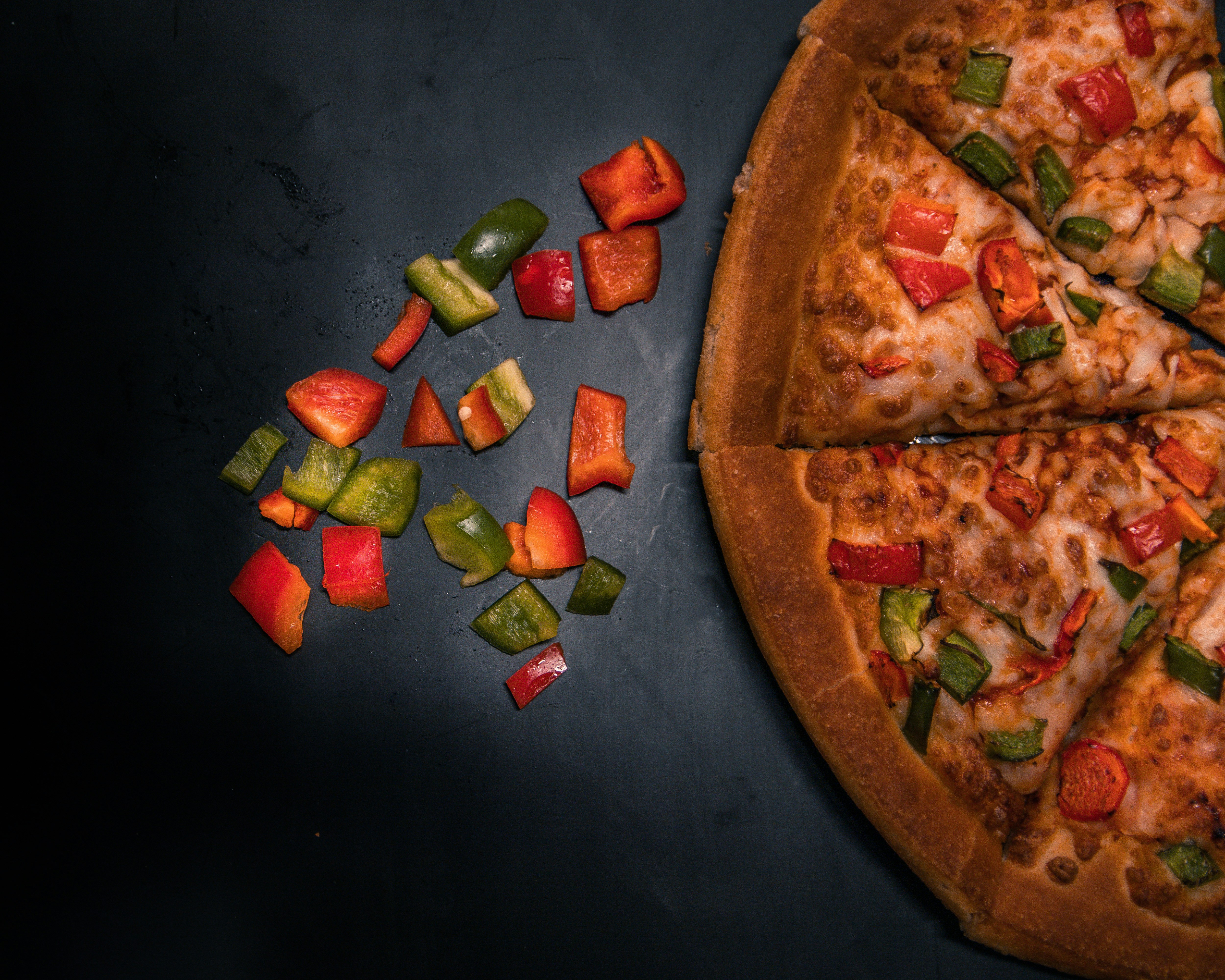 A pizza with several slices cut out of it photo – Free Food Image on ...