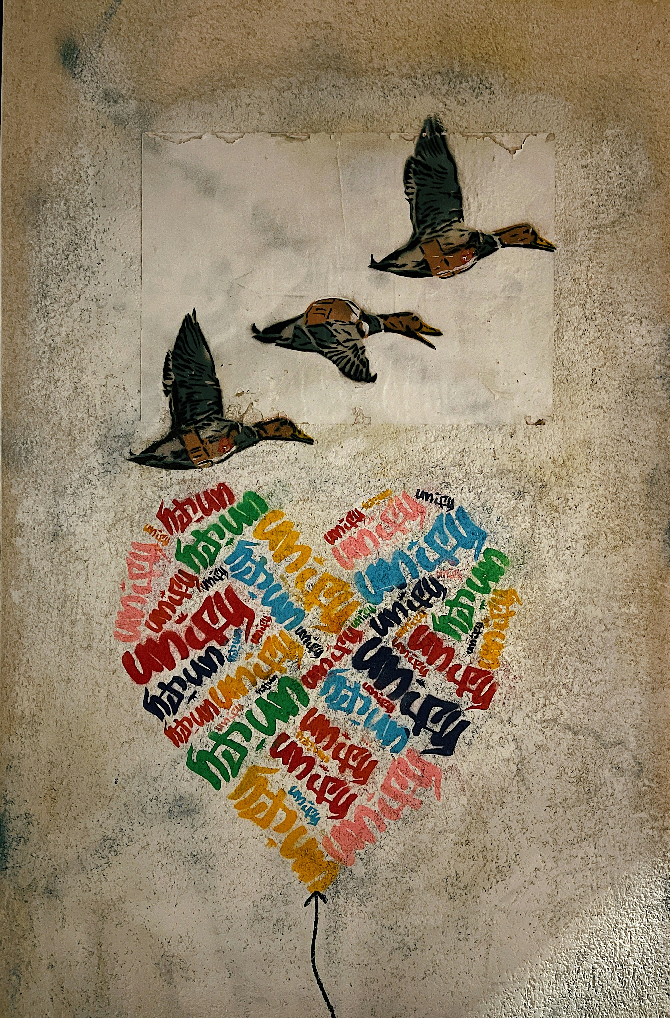 Ducks in Formation Over a Rainbow Word-Heart Graffiti