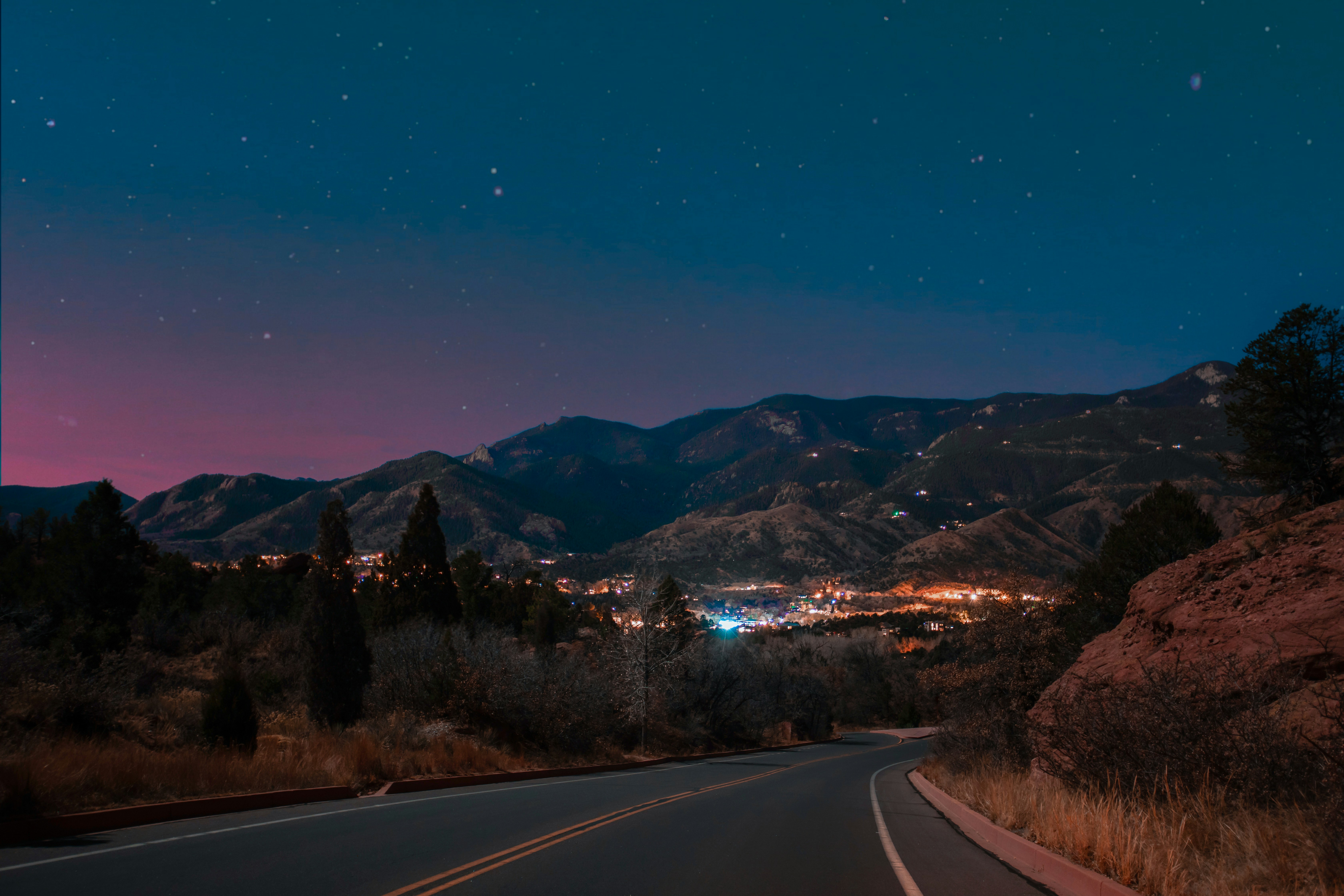 A night time view of a mountain road photo – Free Grey Image on Unsplash