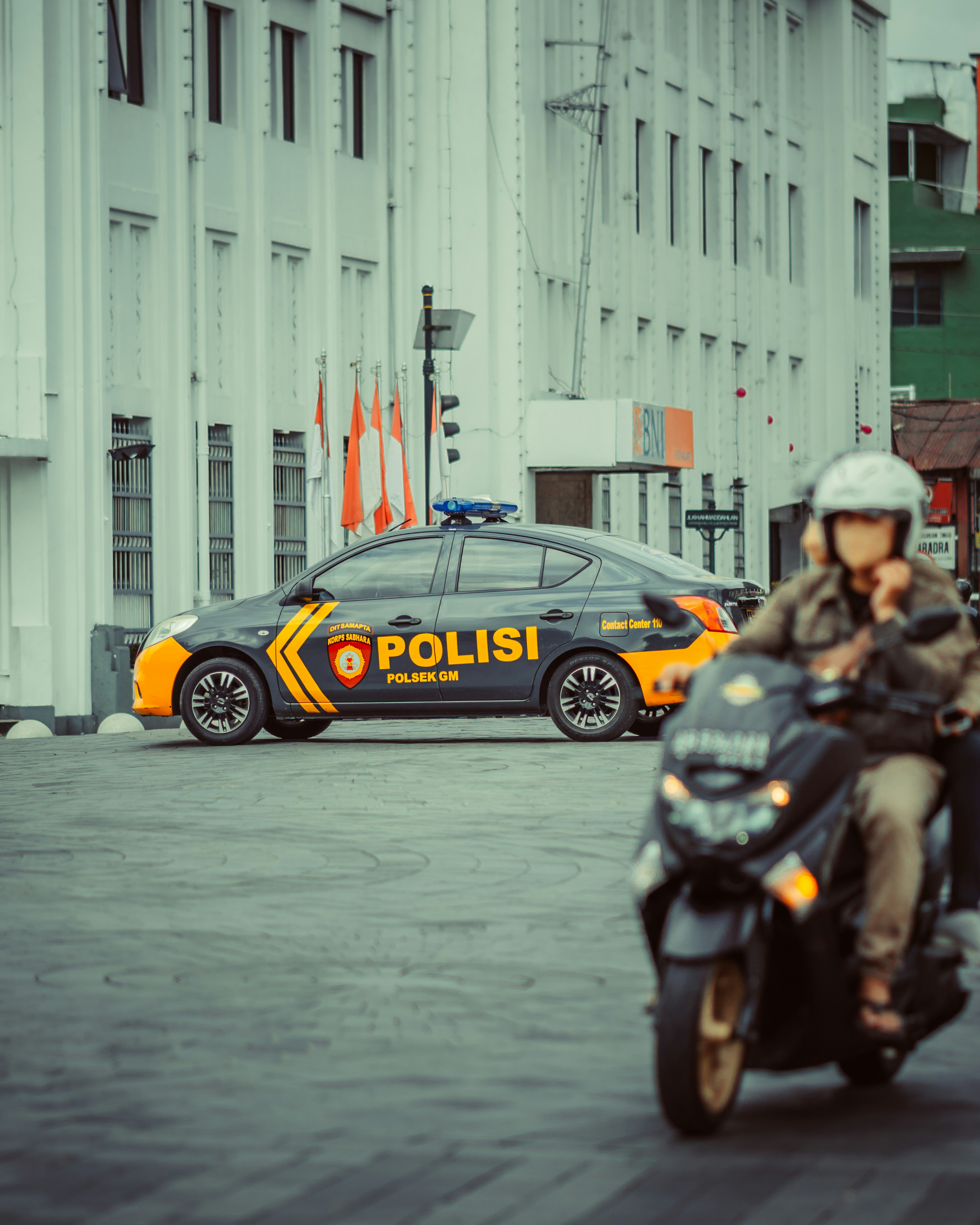 Police car with motorbike foreground