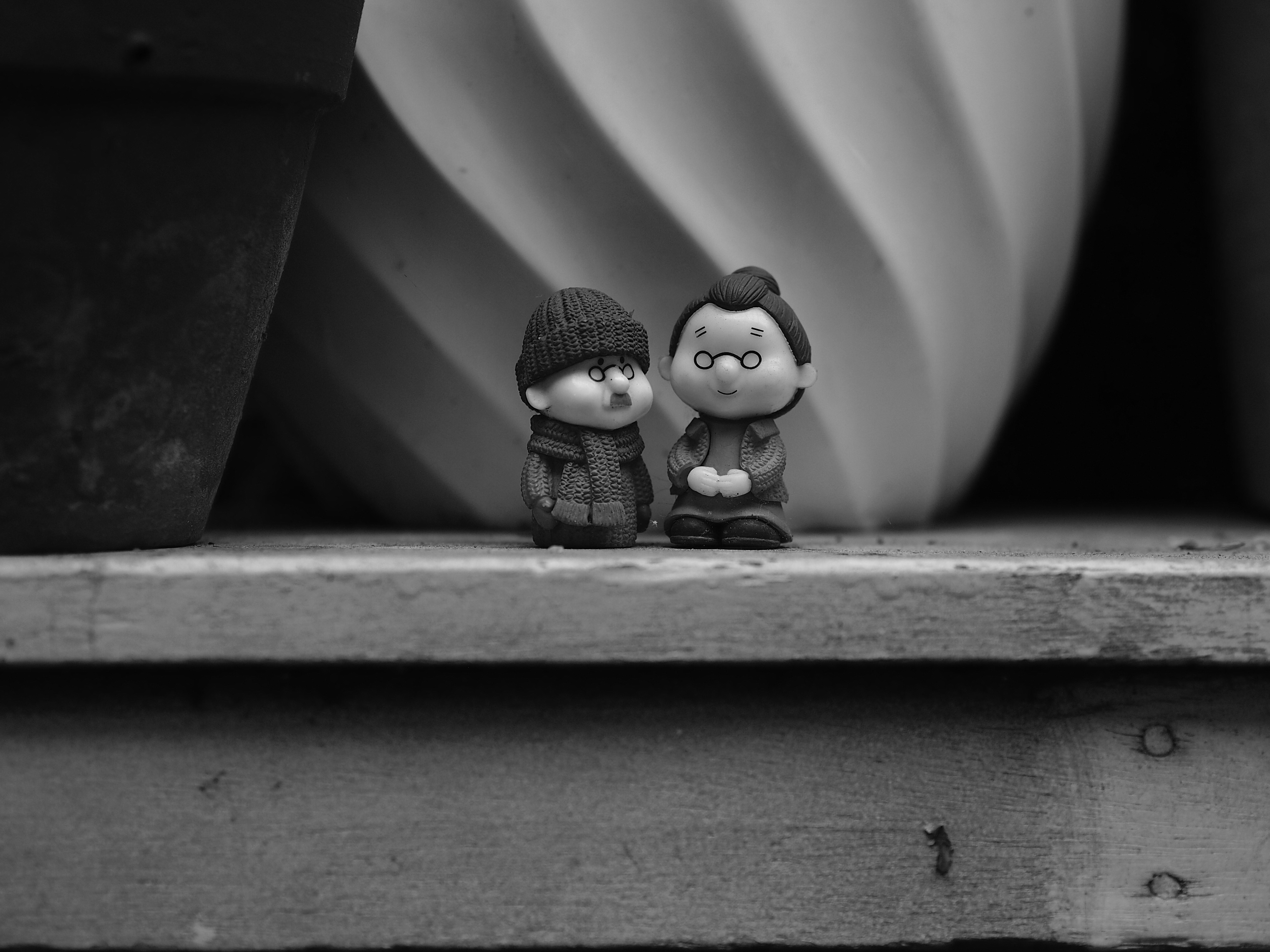 Small figurines, big moment: quiet companionship on a plank