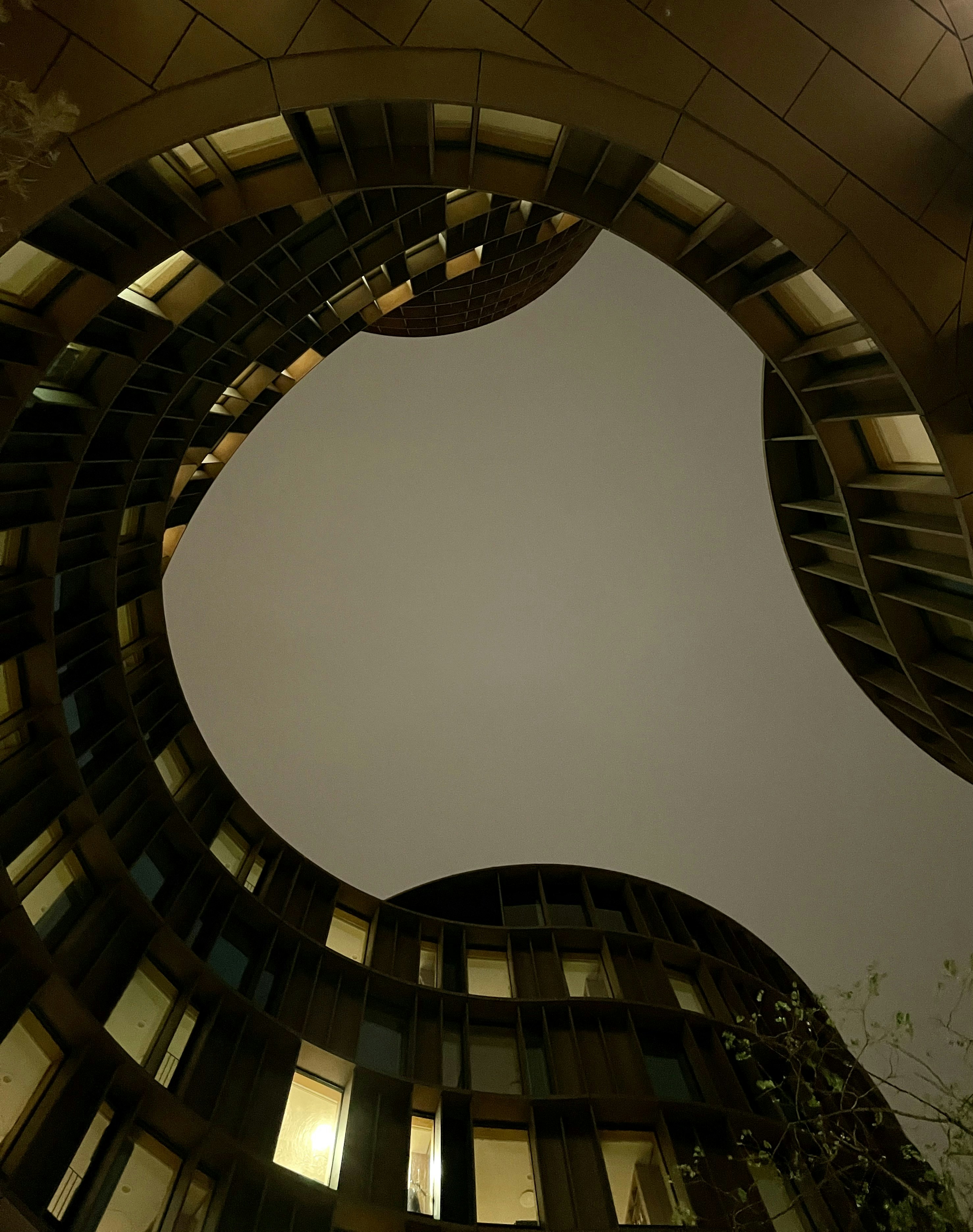 A very tall building with a circular window photo – Free Copenhagen ...