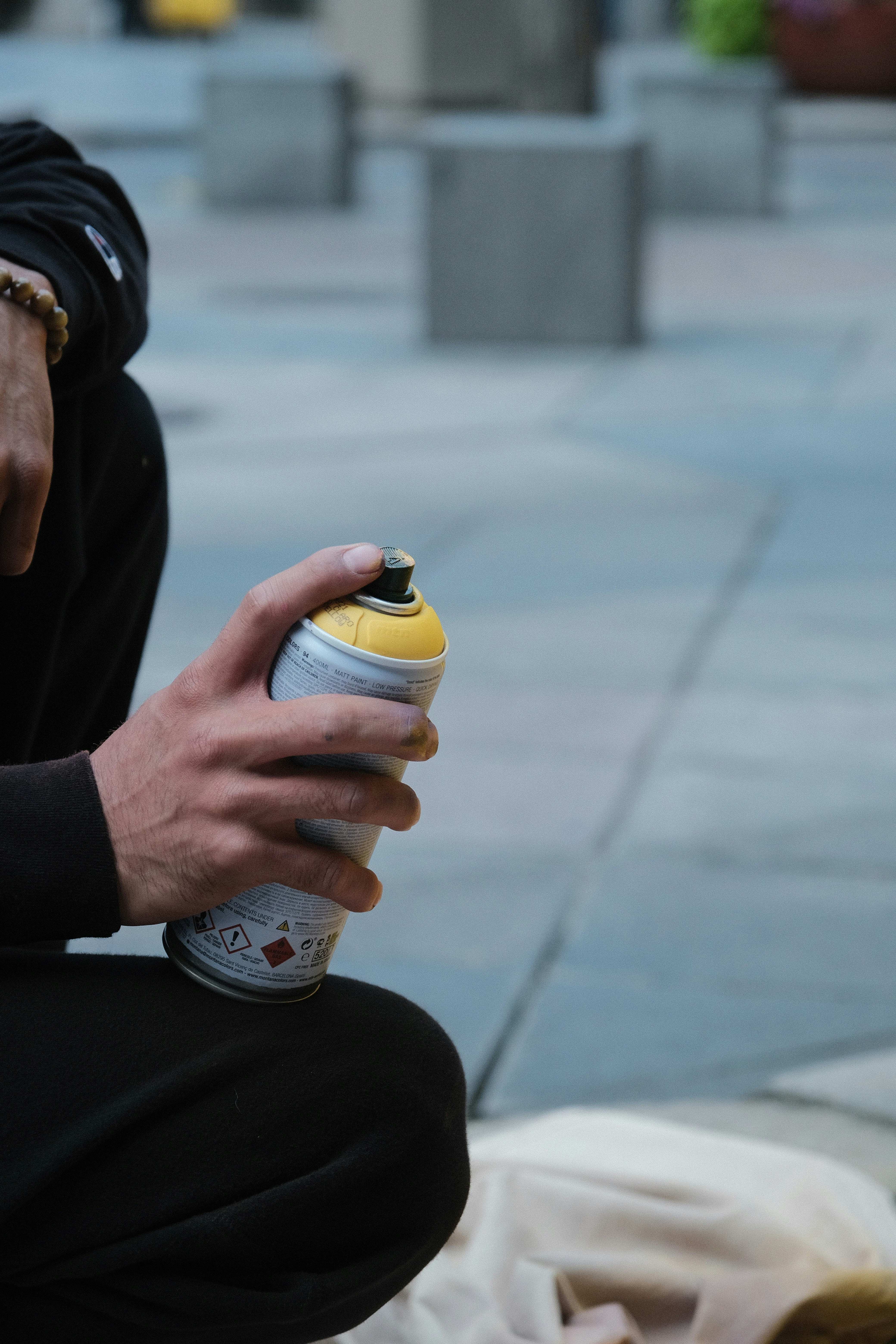 Spray Can in Quiet Focus: A Street Moment