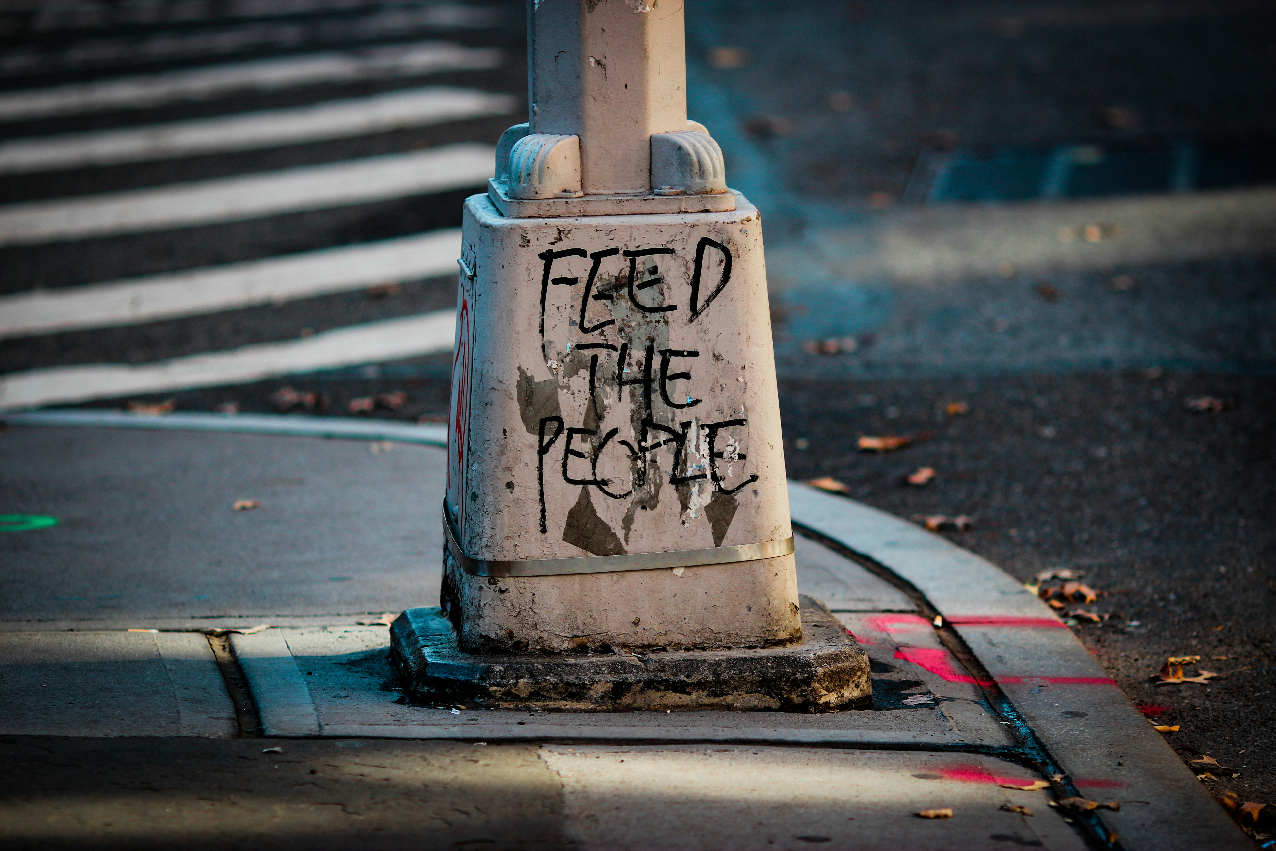 A street pole with graffiti written on it photo – Free Grey Image on ...