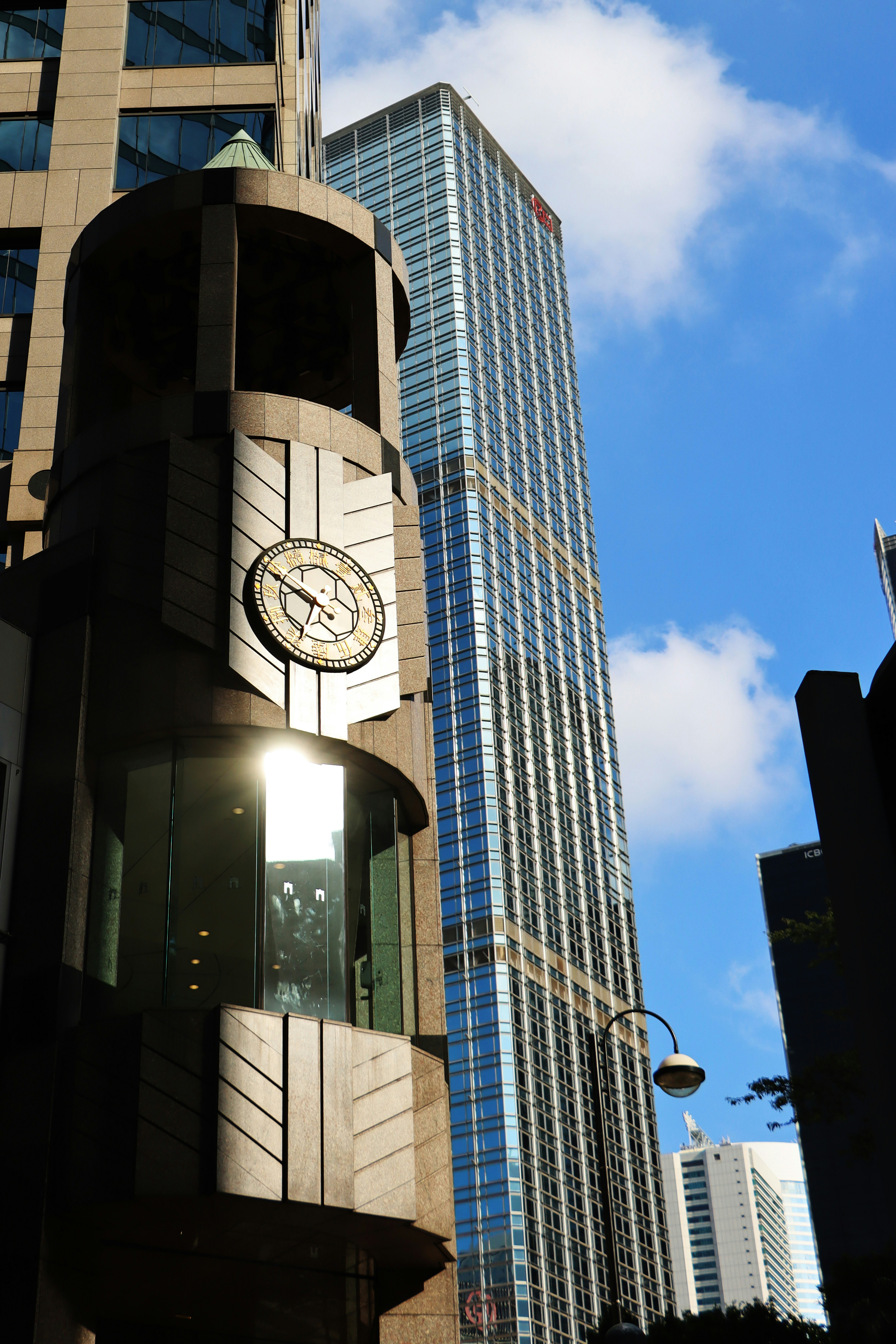 A clock on the side of a building in a city photo – Free 香港 Image on ...