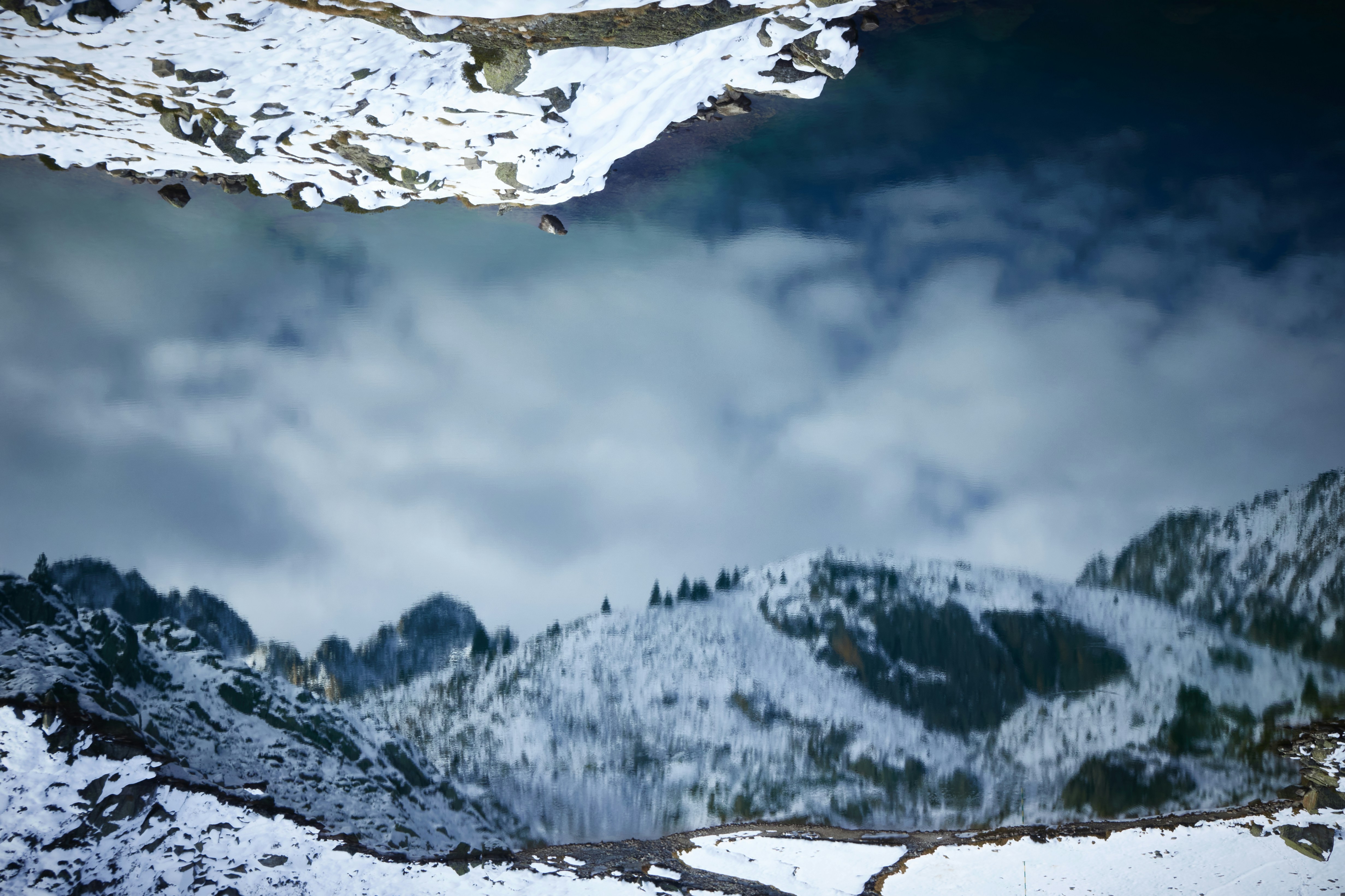 A snow covered mountain with a lake below photo – Free Refuge de la ...