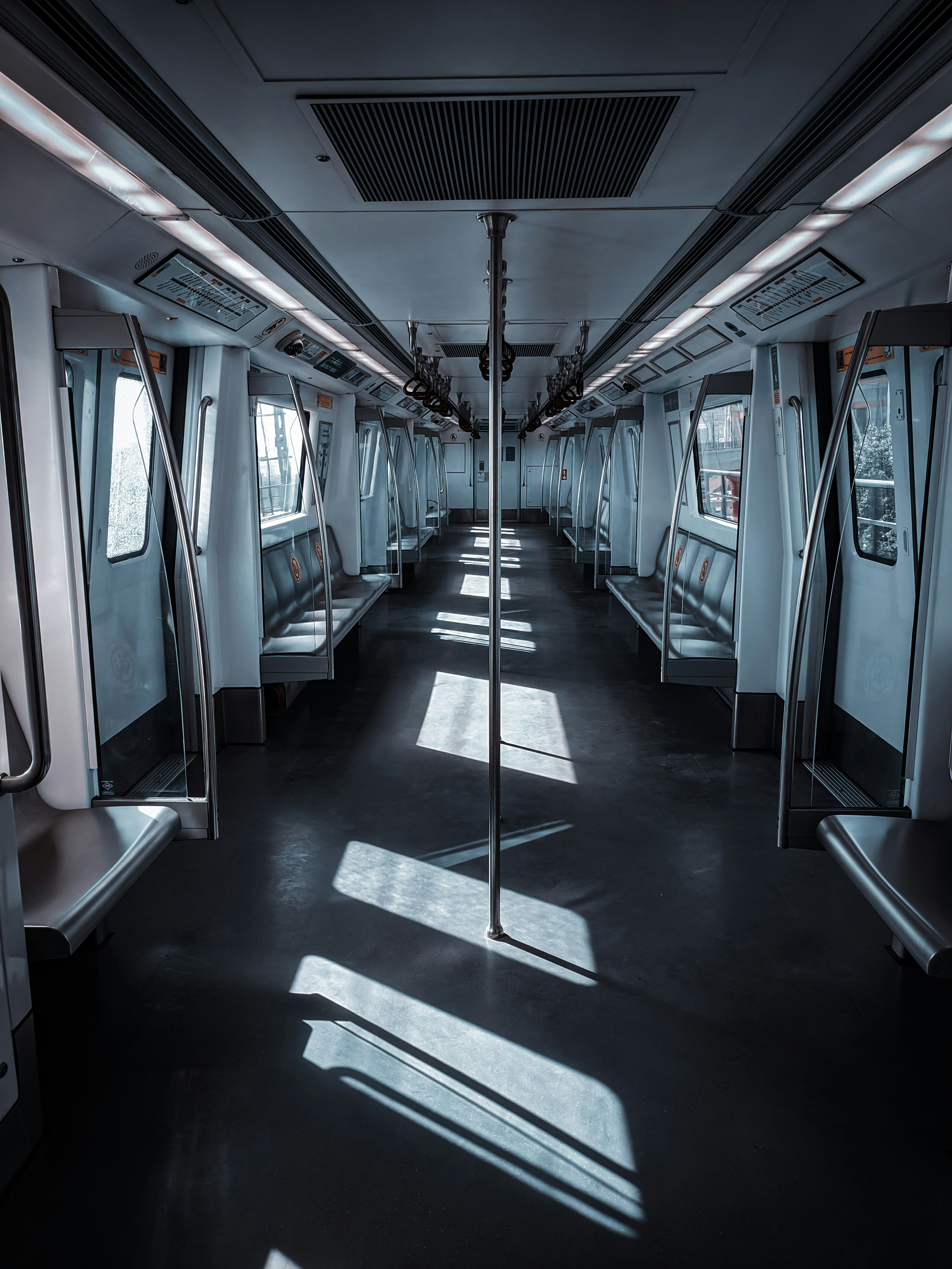 A long empty train car with lots of windows photo – Free Train Image on ...