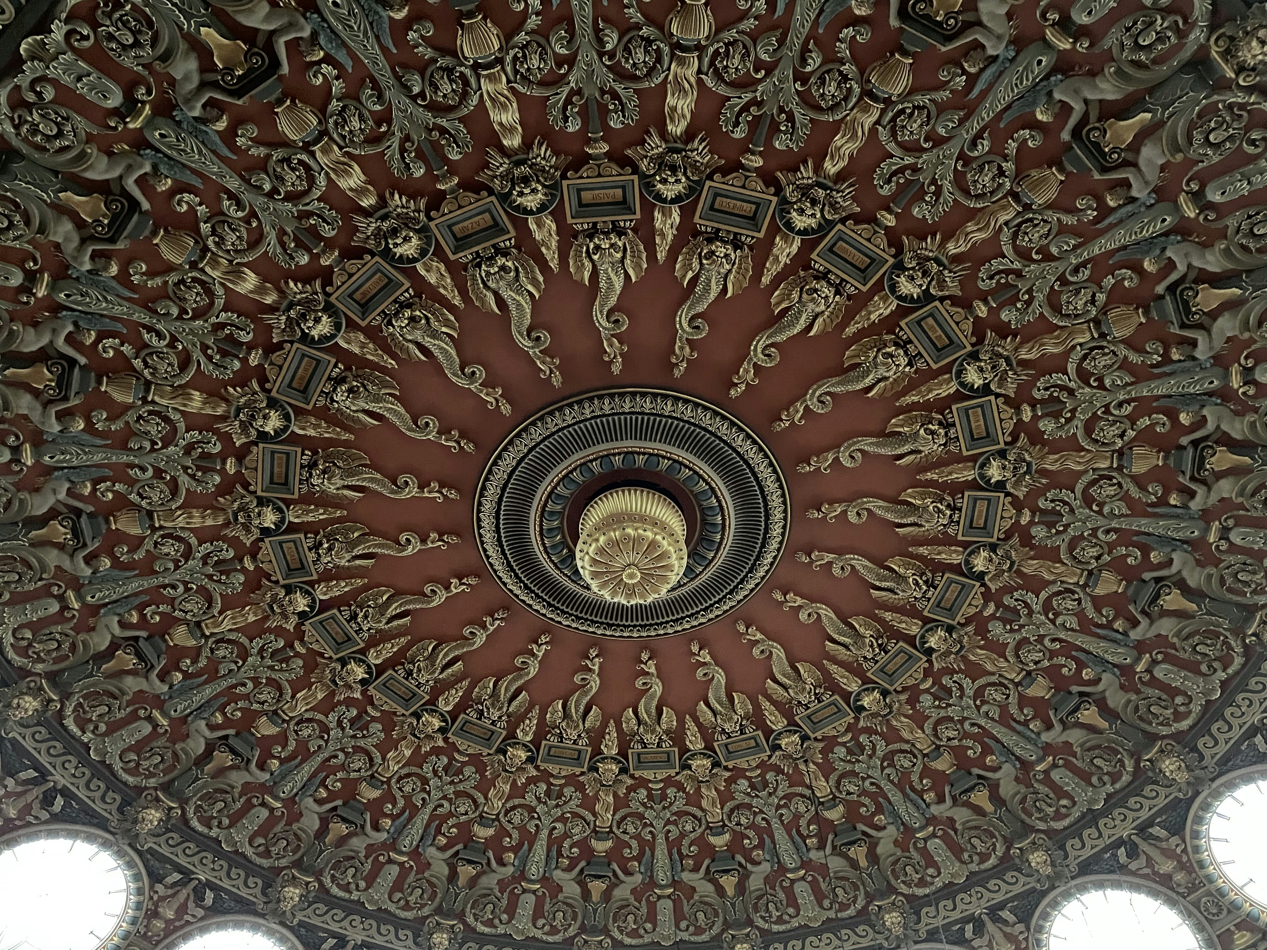 Rotunda of Living Figures: A Circular Tapestry of Carved Ceiling