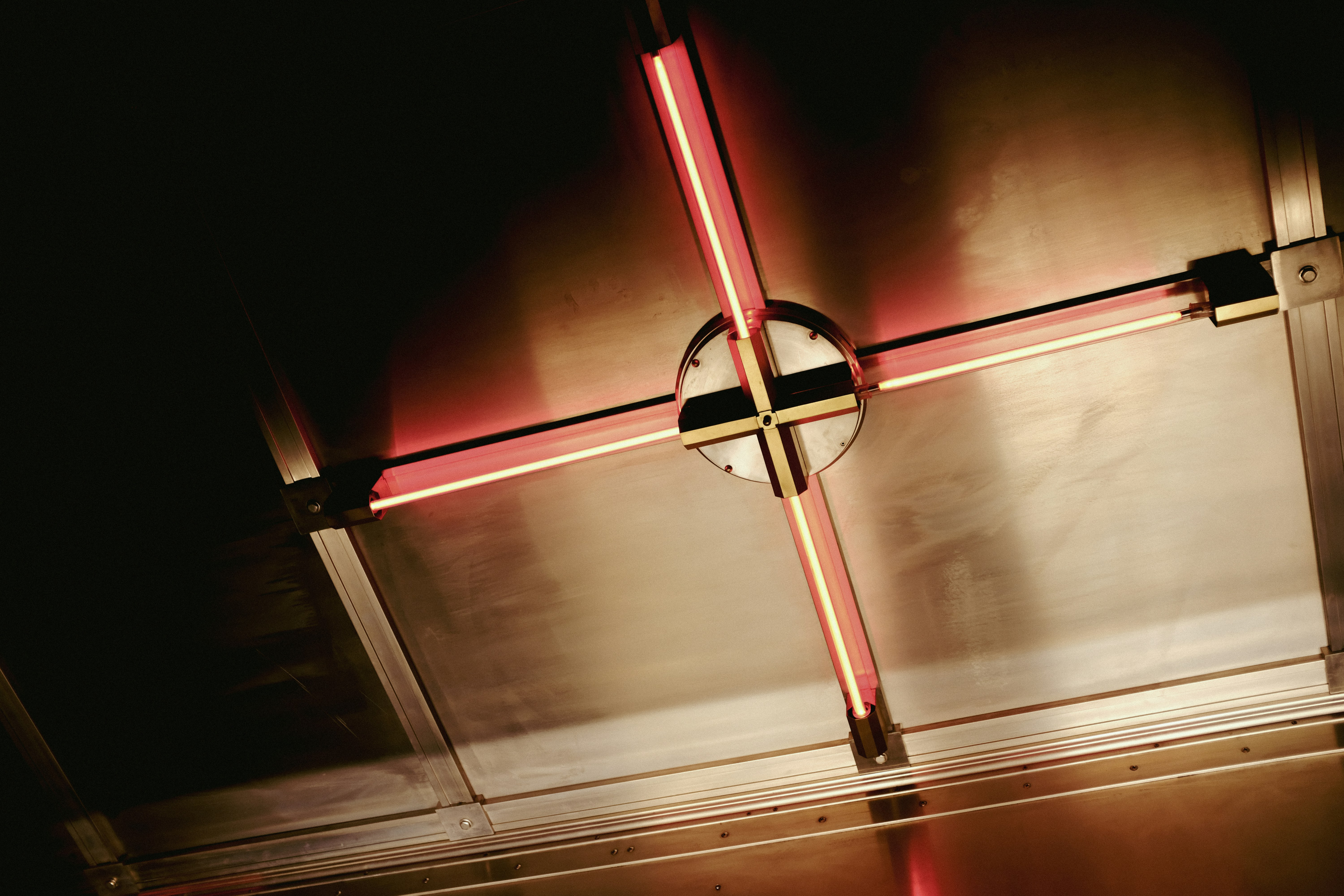 Neon Crossroads of Light in a Metallic Labyrinth