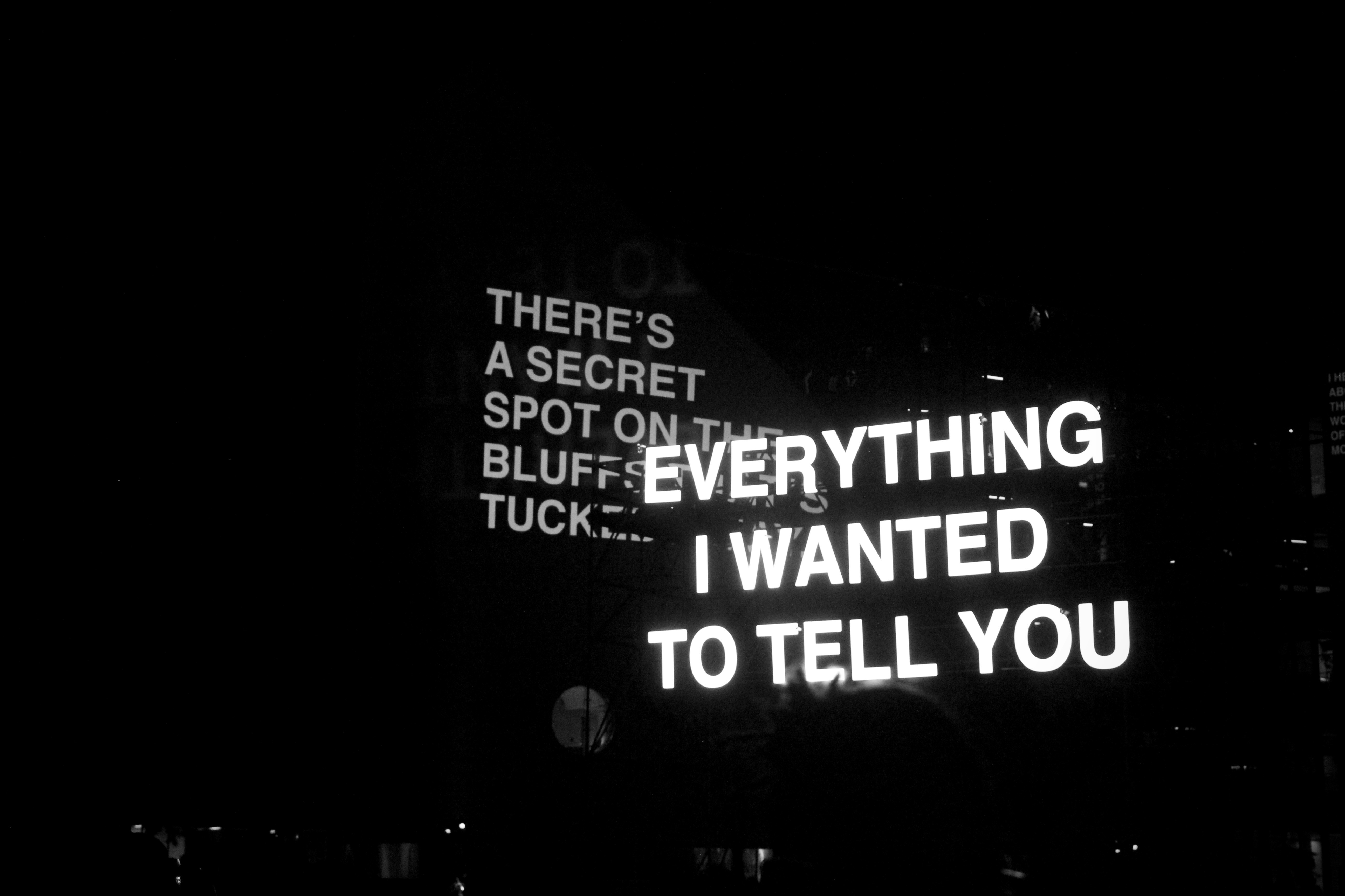 a black and white photo of a street signDavid Lam