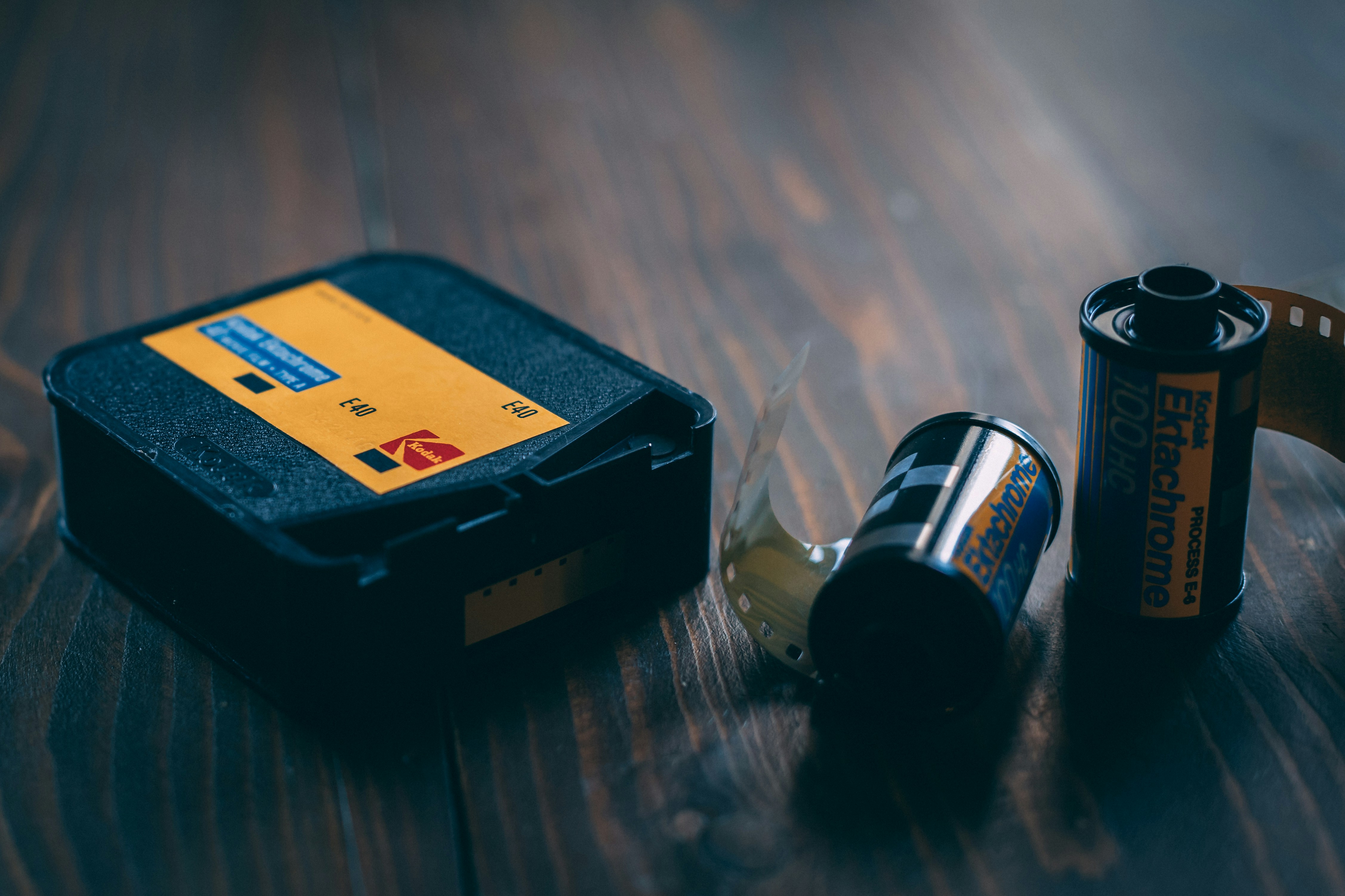 A couple of batteries sitting on top of a wooden table photo – Free ...