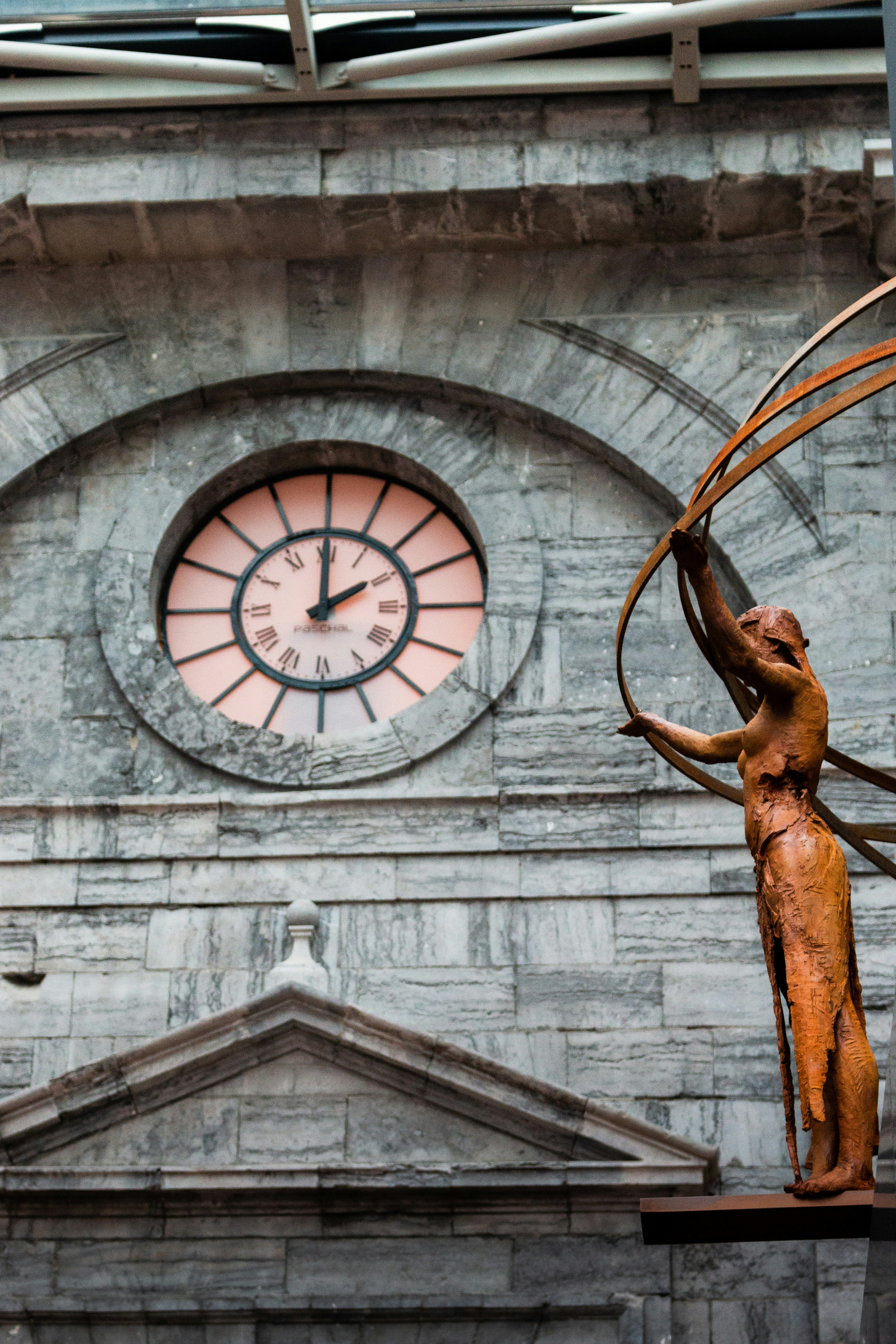 Clock Tower and Orbital Figure: A Leaning World in Bronze