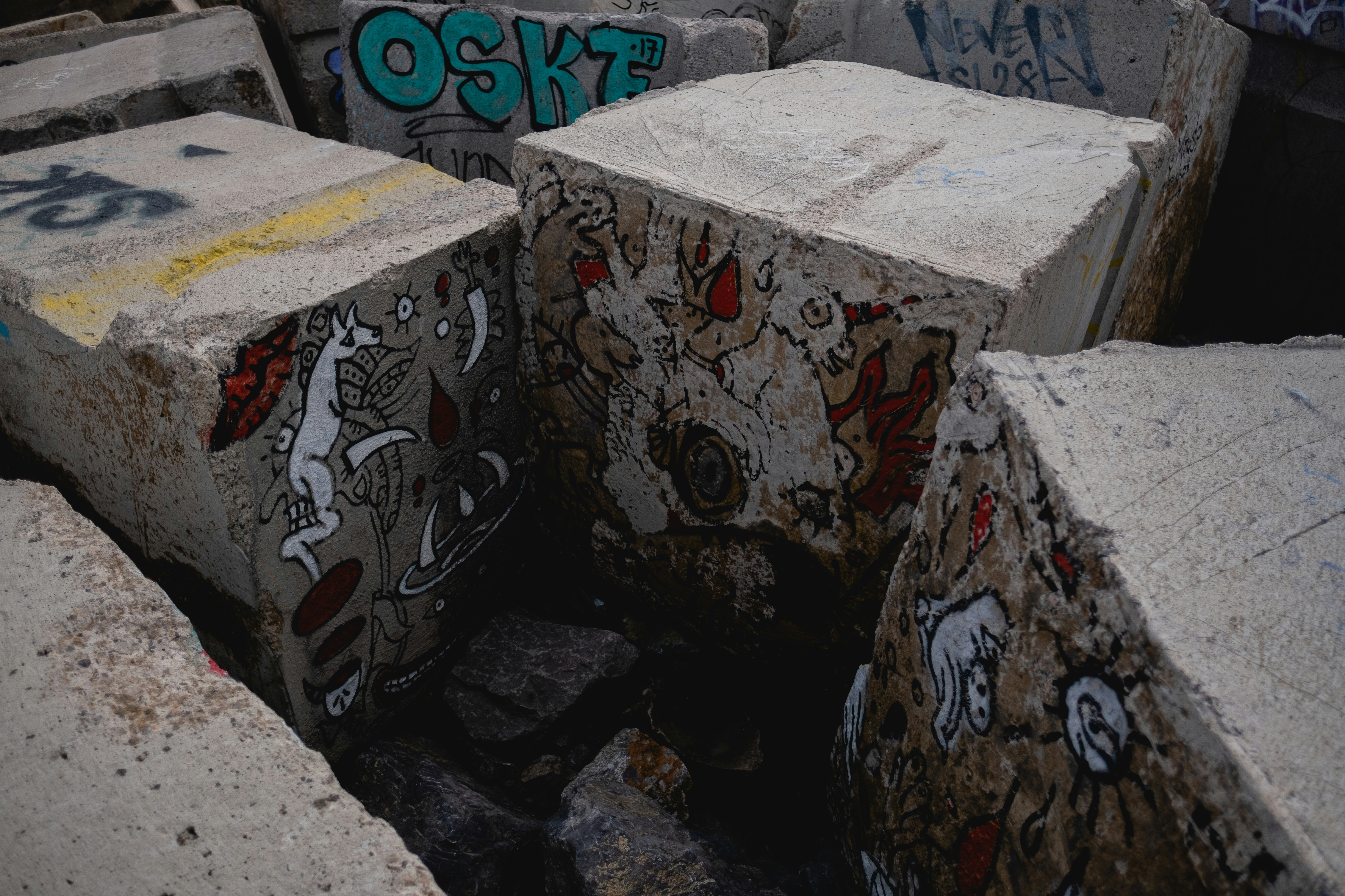 A group of cement blocks with graffiti on them photo – Free Barcelona ...