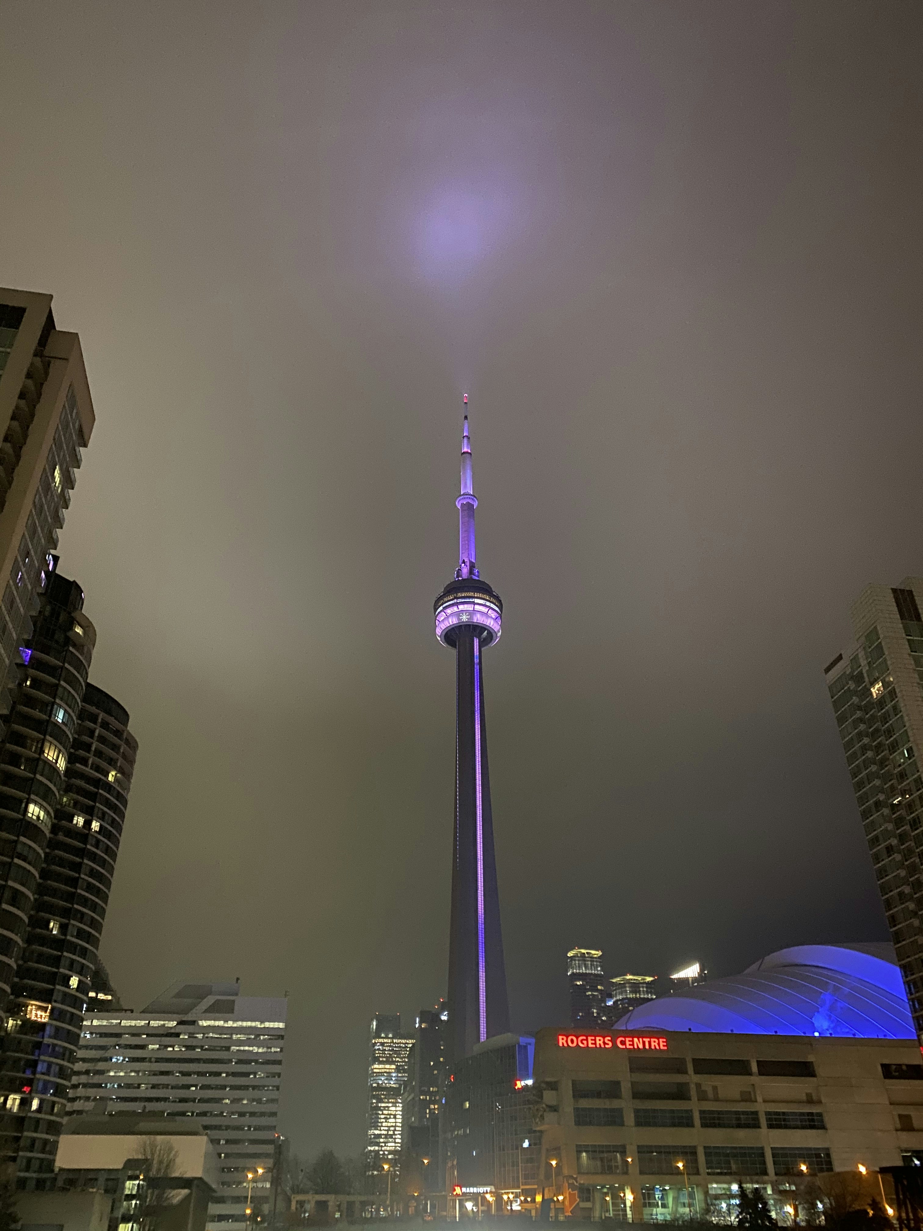 a very tall tower towering over a city at night