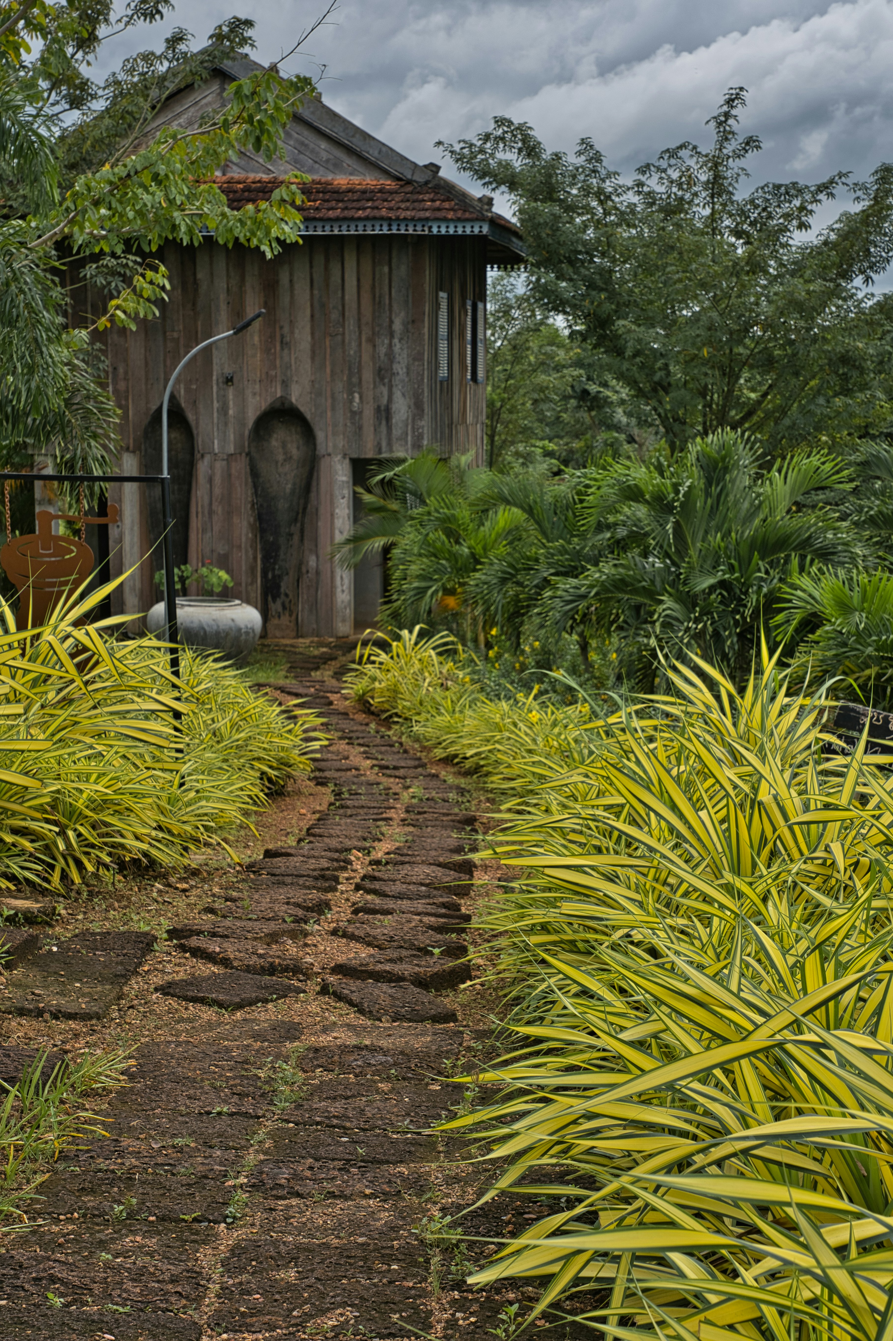 Path to a Quiet Cabin: A Stone Walkway Through Golden-Hued Foliage