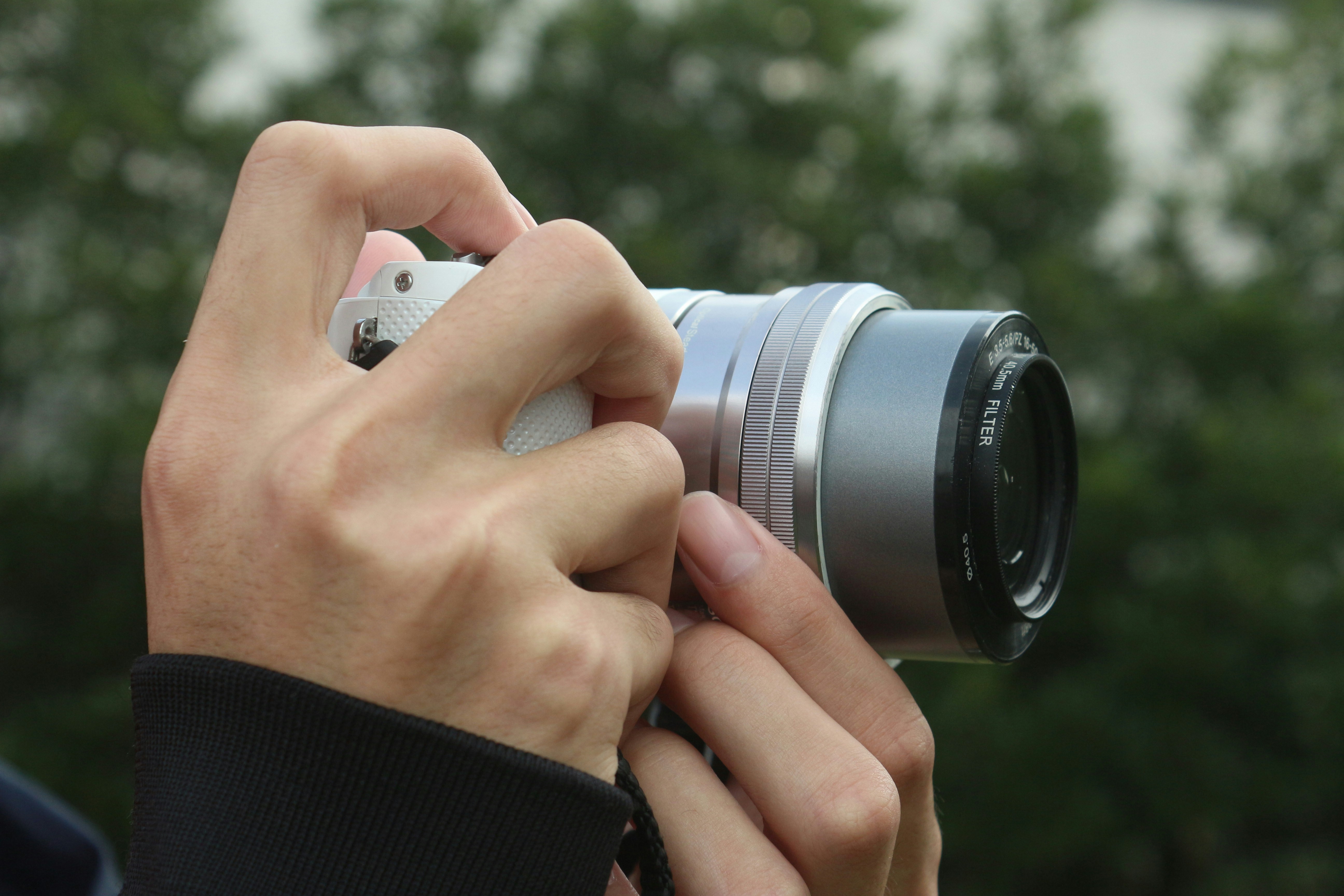 a person taking a picture with a camera
