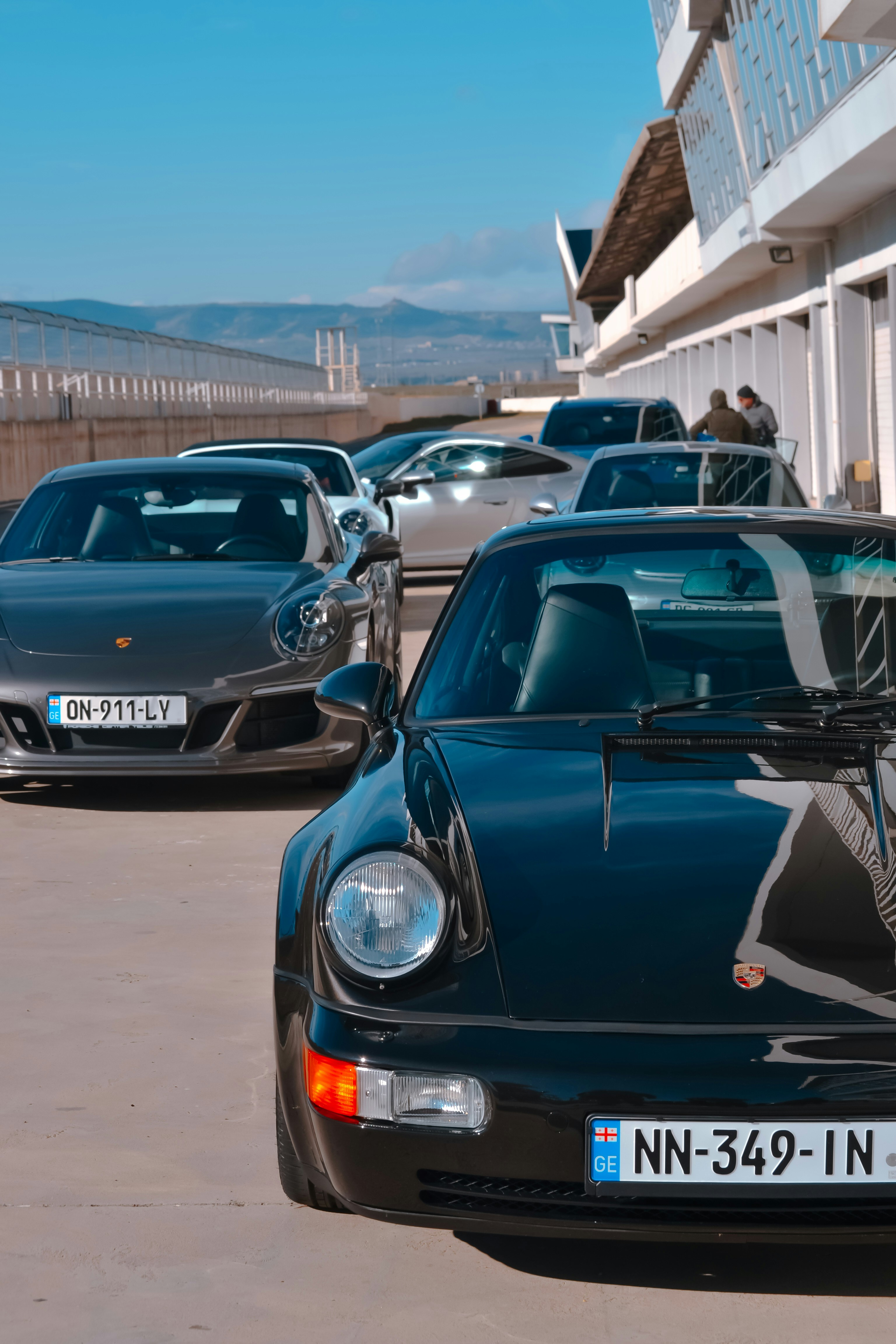 Front Row of Classic Porsches: Morning Light on the Port
