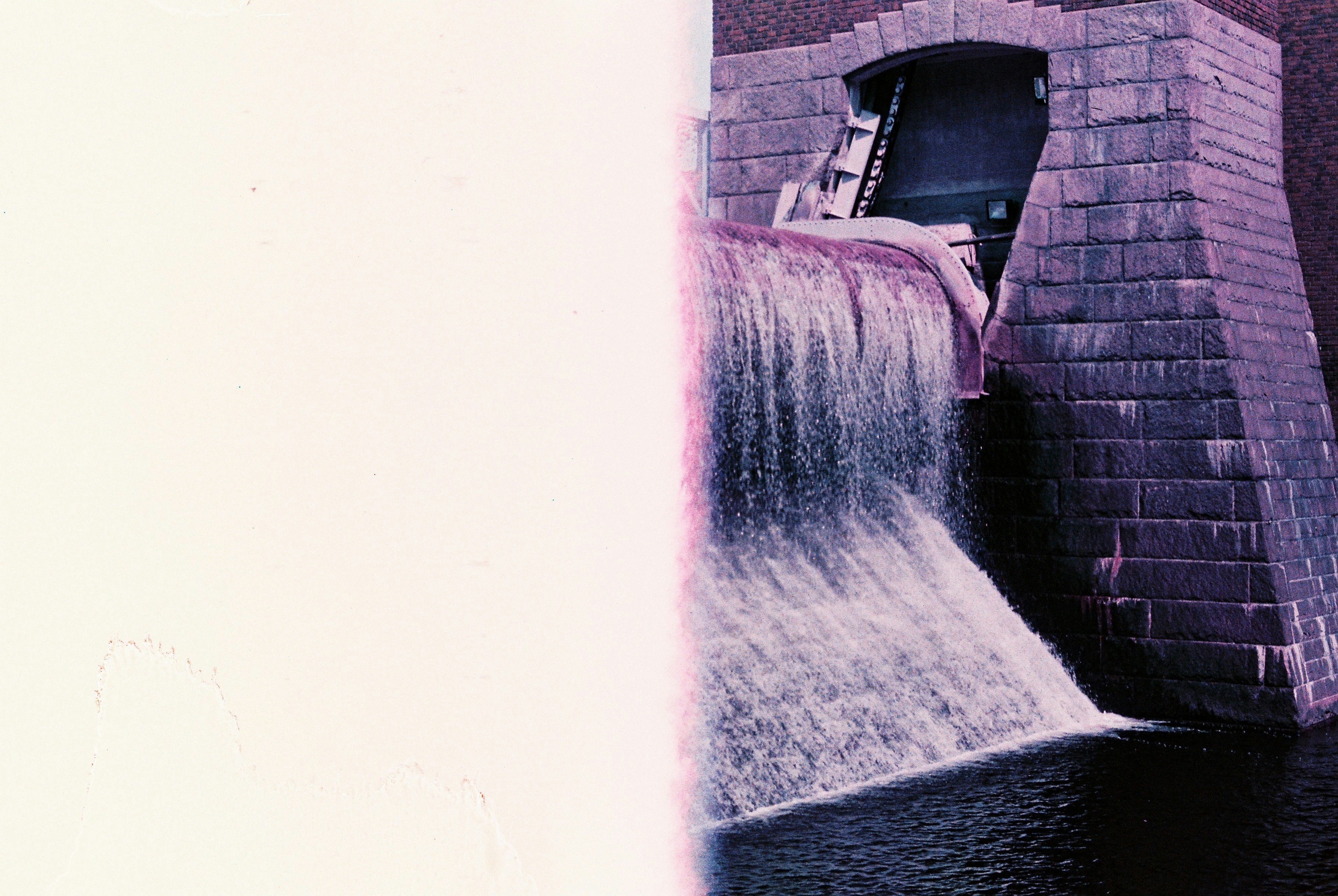 A brick structure with a waterfall coming out of it photo – Free ...