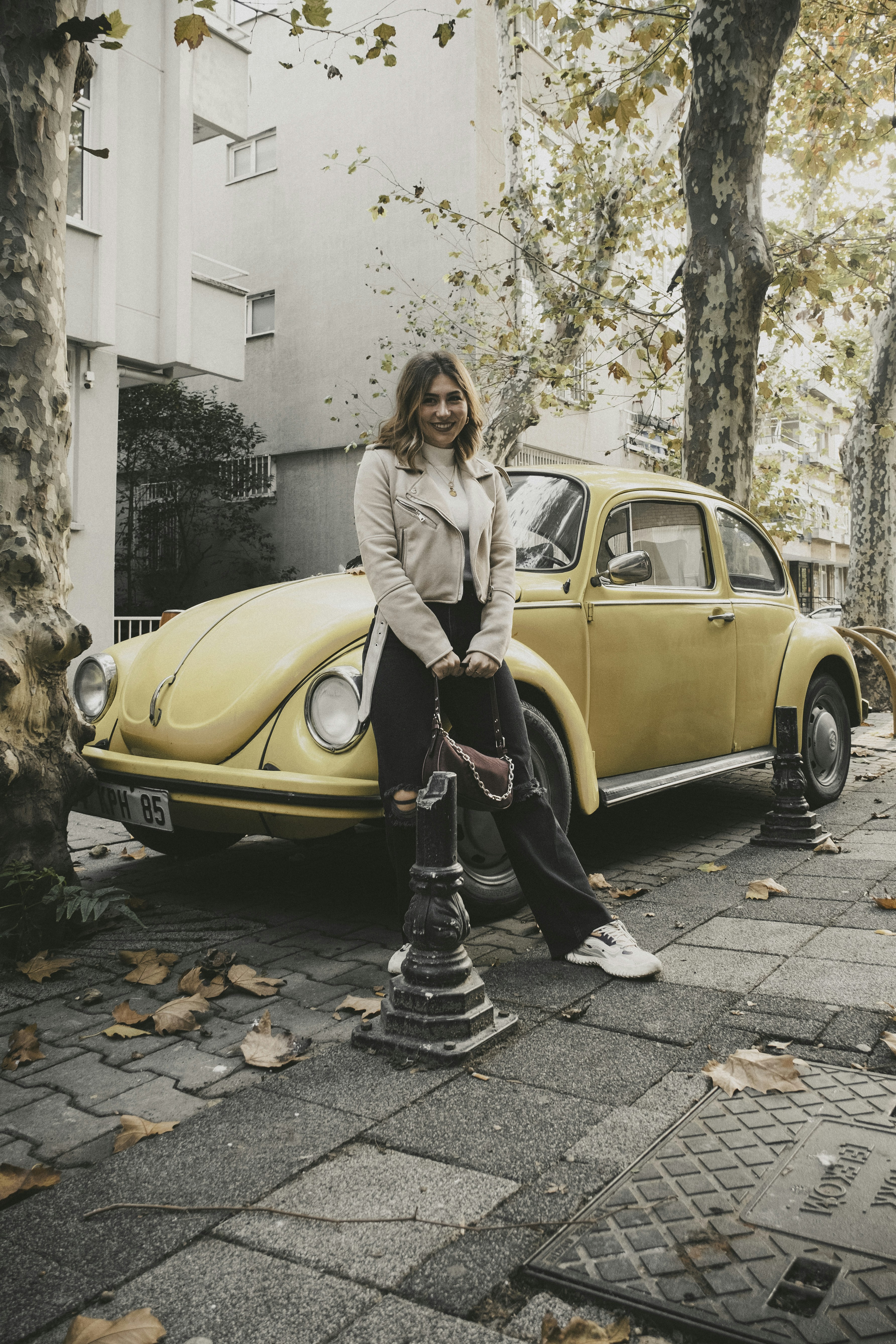 Autumn Street Portrait: A Warm Smile by the Yellow Beetle