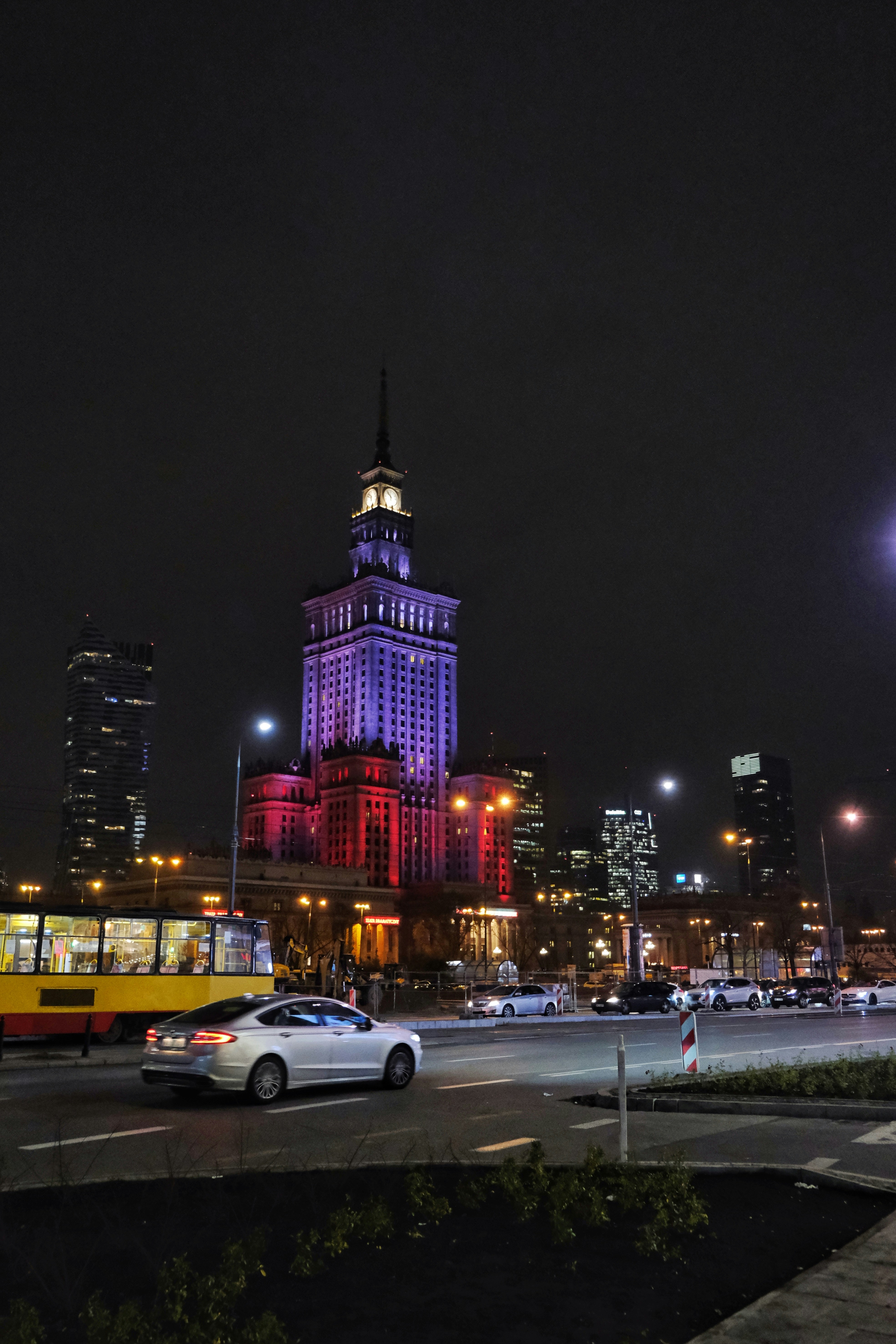 A city at night with a bus and a bus stop photo – Free Travel Image on ...