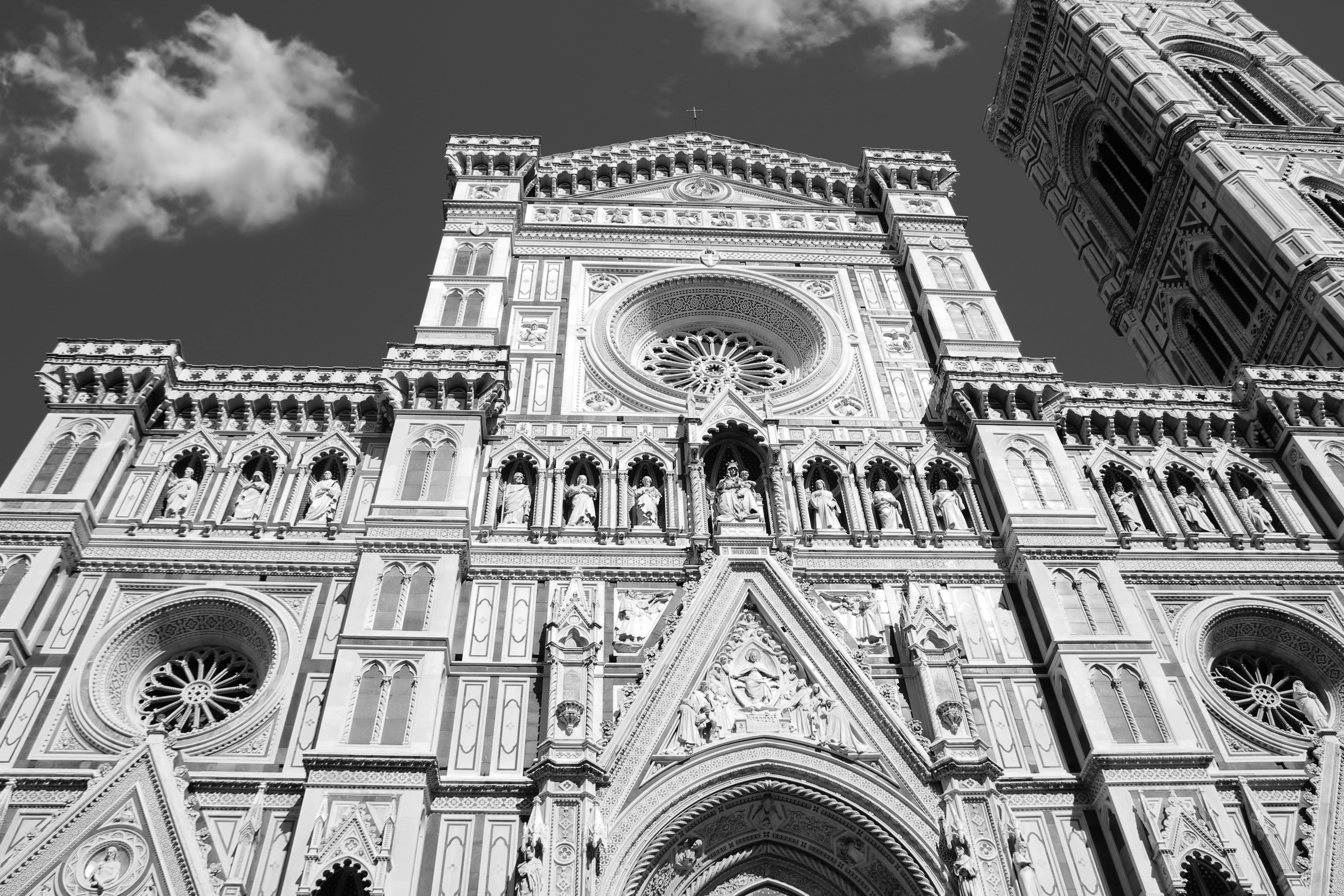 Rose Window Crown: A Low-Angle Monochrome Study of a Gothic Cathedral Facade