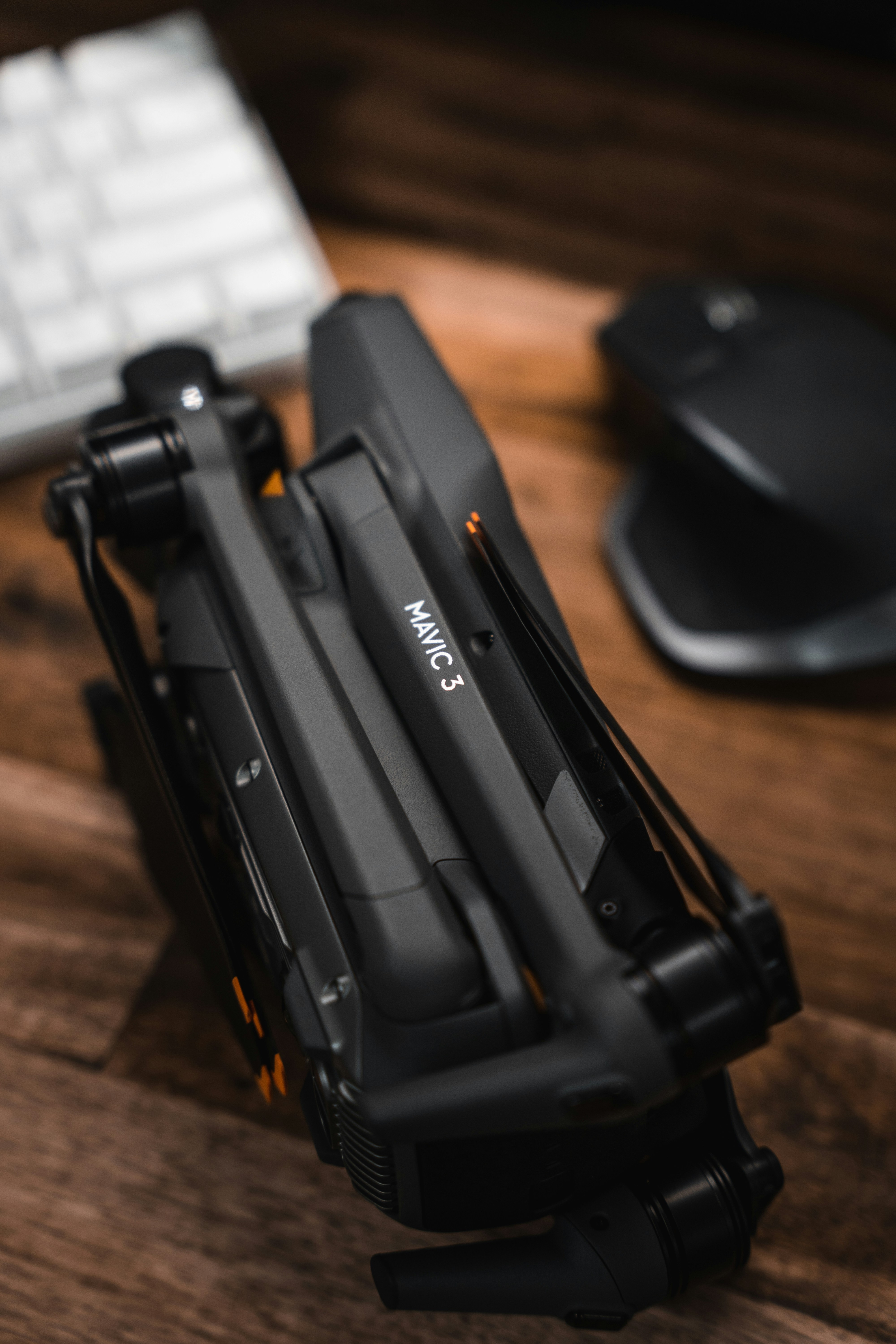 Folded Mavic 3 on a Walnut Desk: Precision in Quiet Readiness