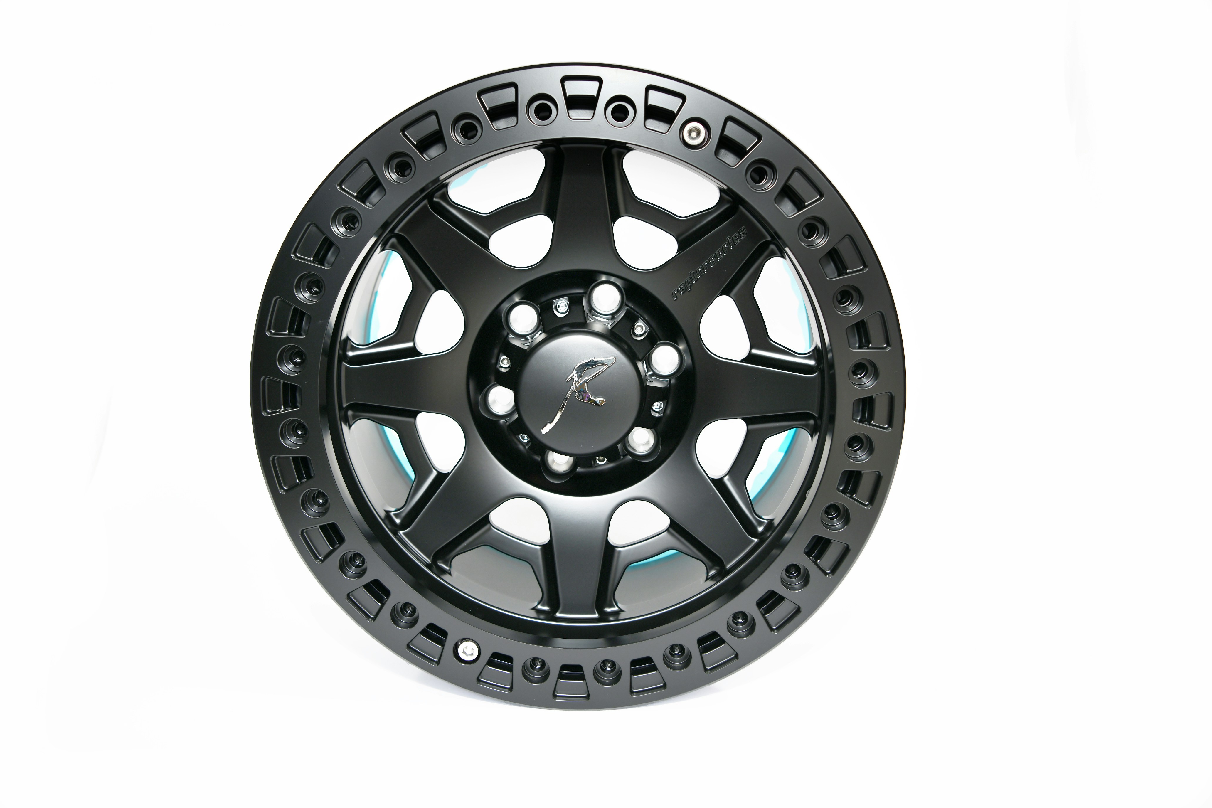 Black steel wheel with multi-spoke design and exposed lug nut details
