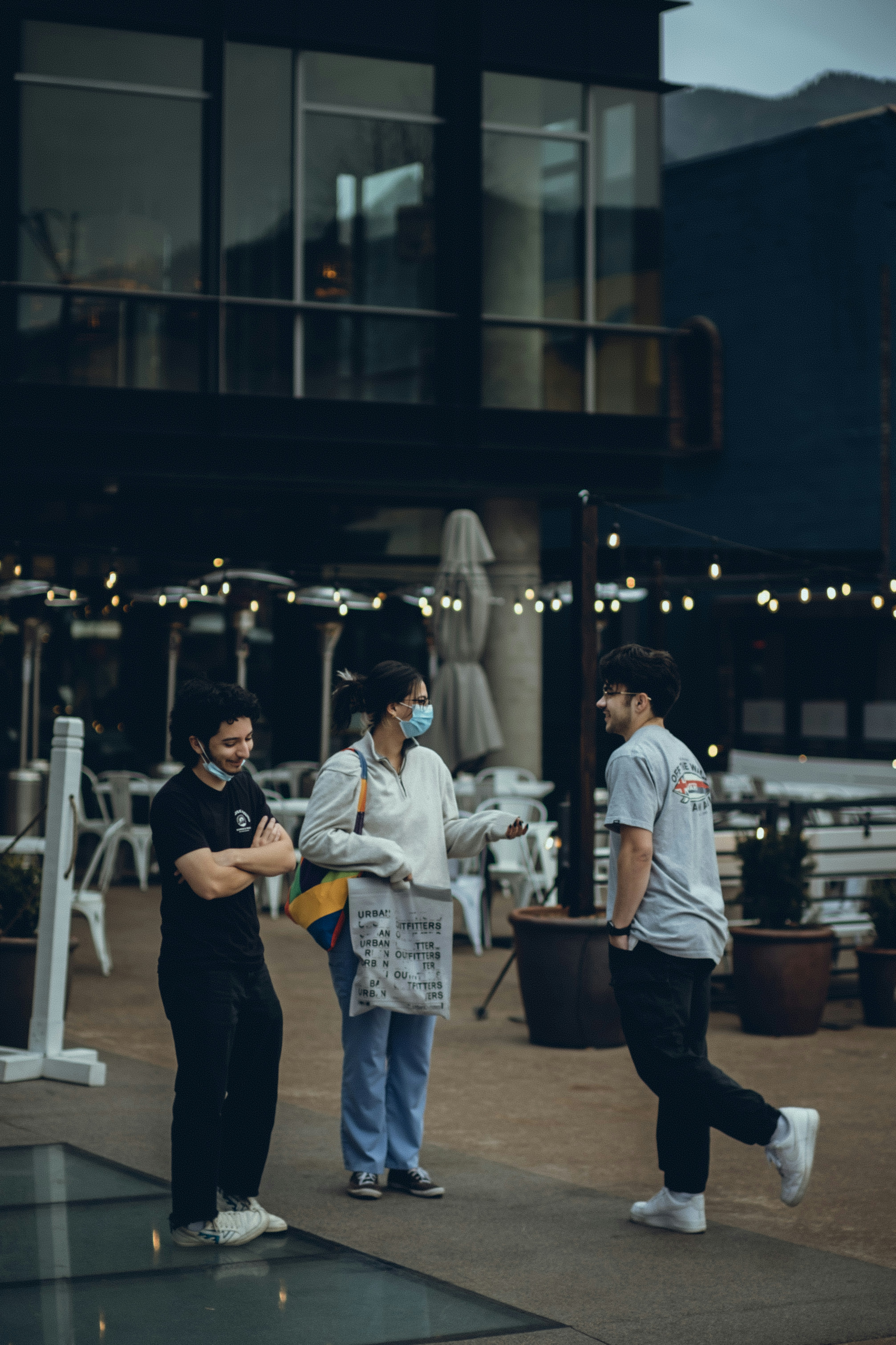 a group of people standing around each other