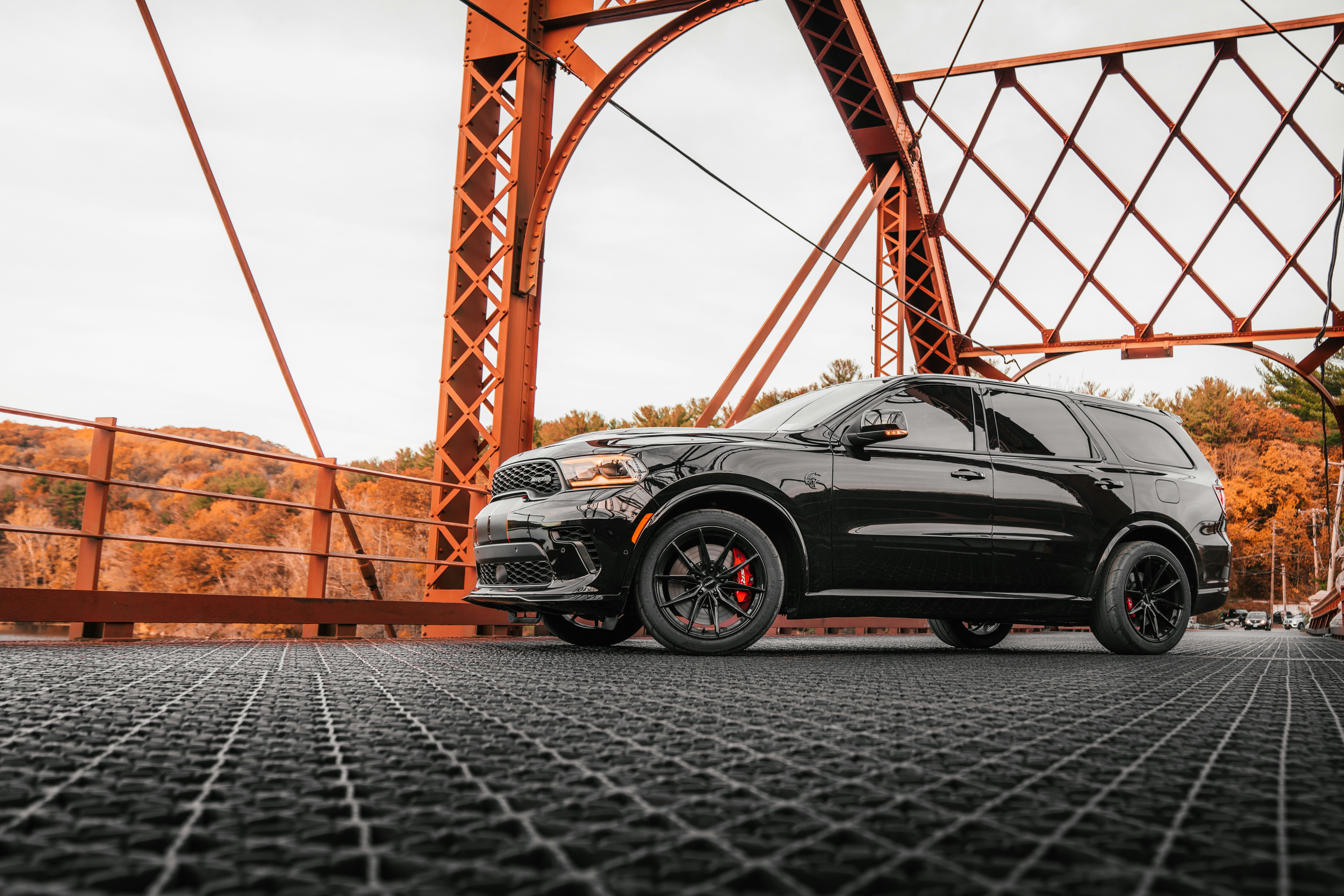 Midnight SUV on a Tangerine Iron Bridge at Autumn's Edge